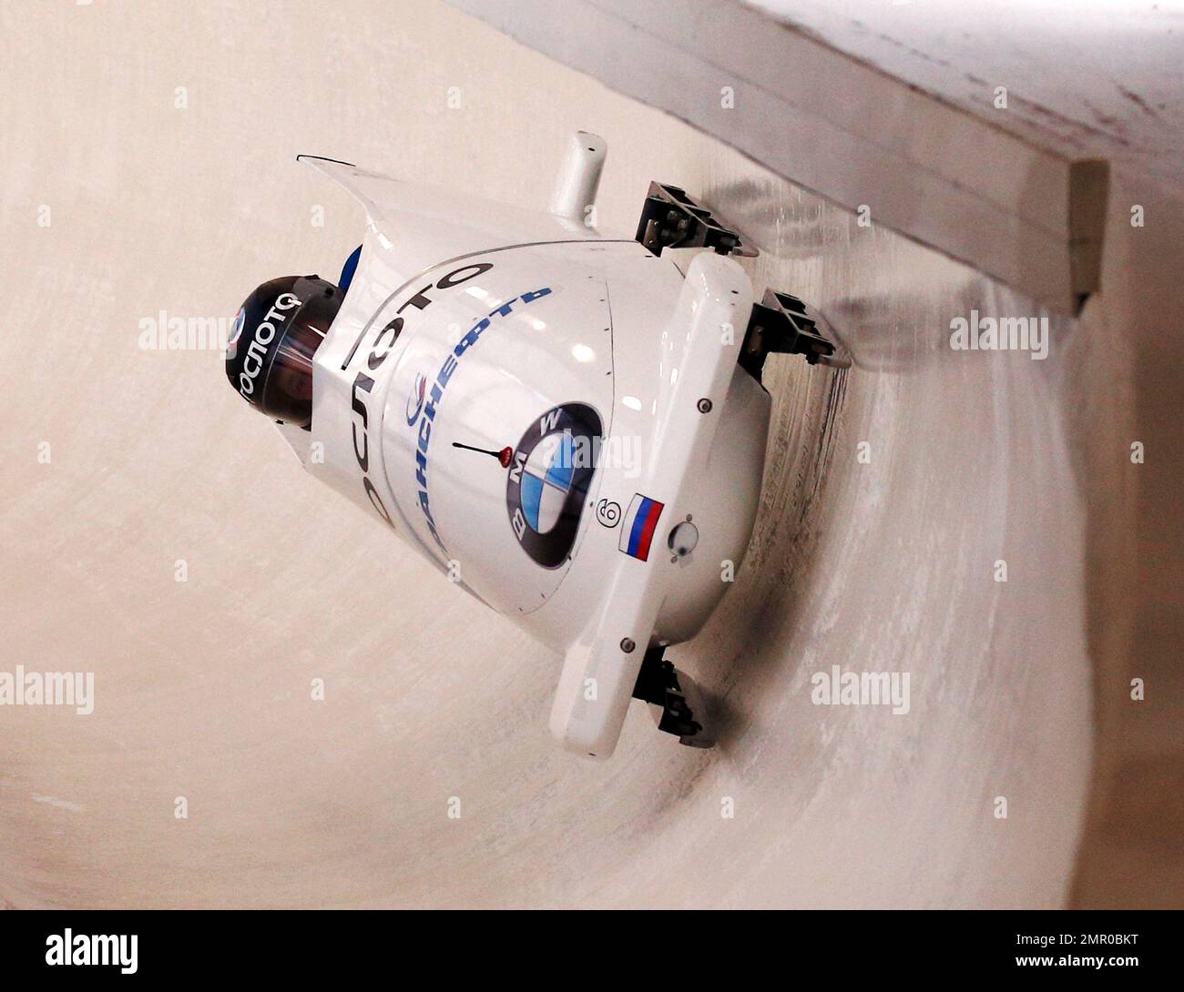 Alex Stulnev of Russia rounds a curve at the World Cup bobsled opener ...