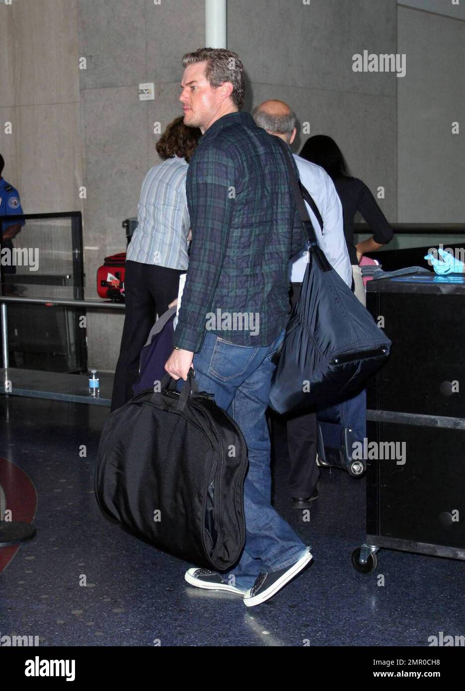 Eric Dane was seen checking in for a flight out of LAX this morning ...