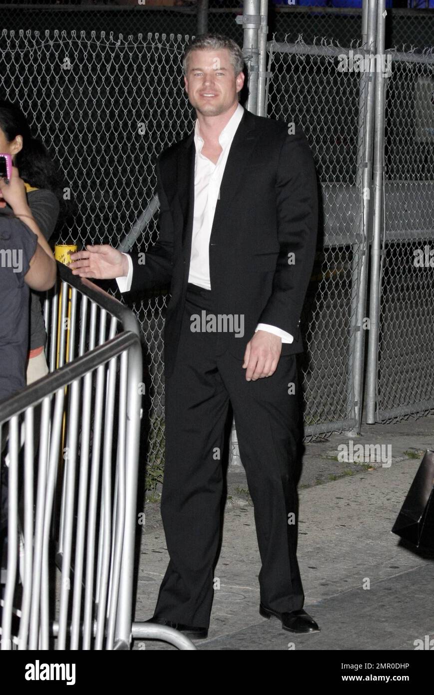 Eric Dane poses for photos and signs autographs as he leaves the ...