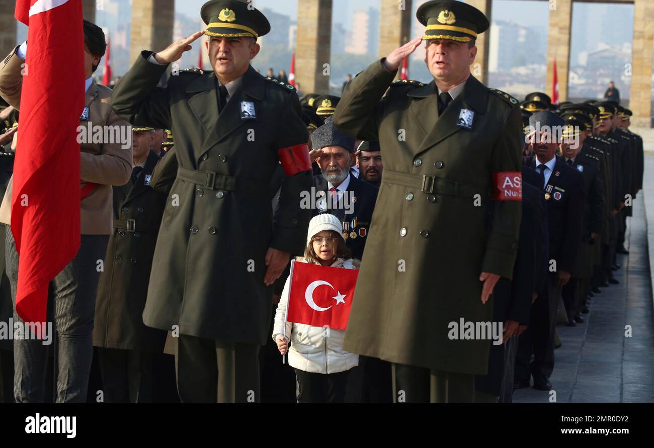 Members of the military and civilians attend a ceremony at the ...