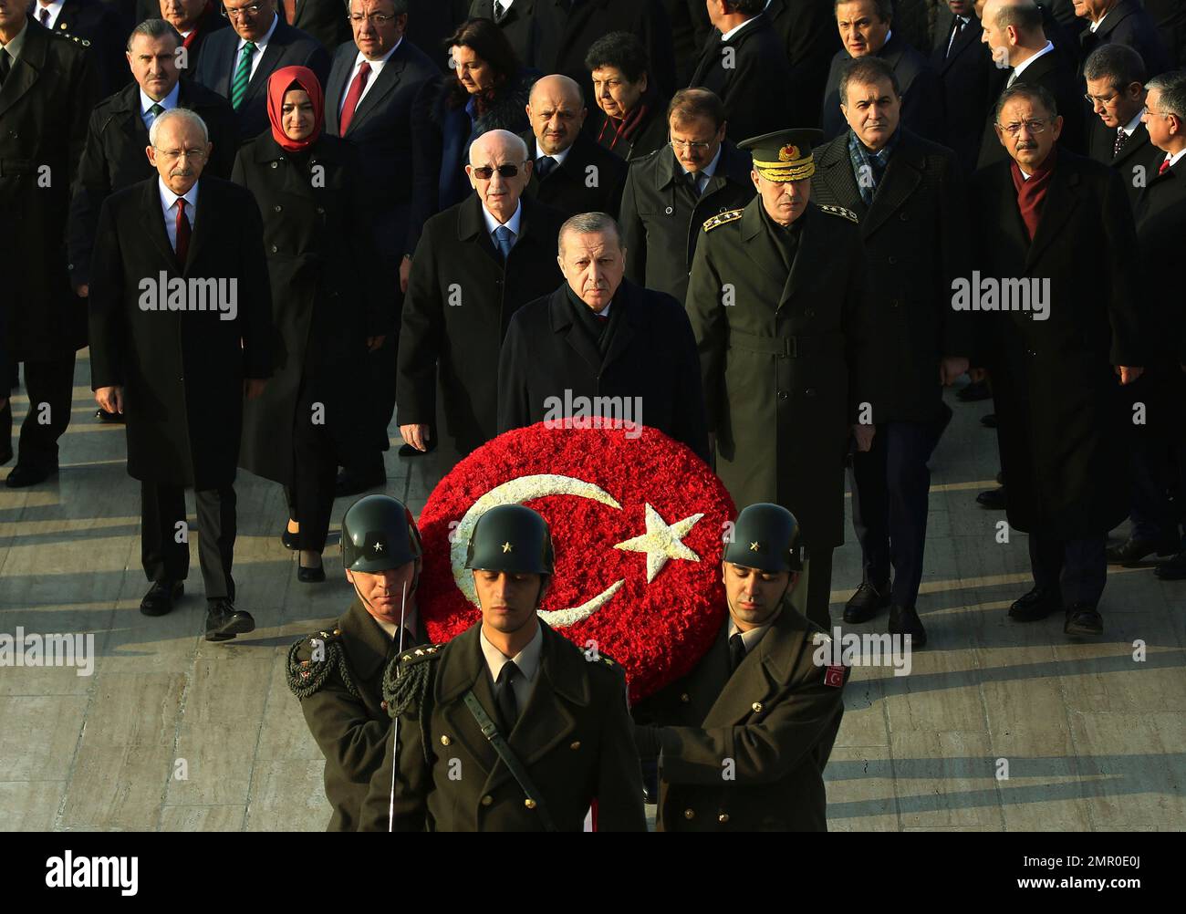 Turkey's President Recep Tayyip Erdogan, centre, attends a wreath-laying ceremony at the ...