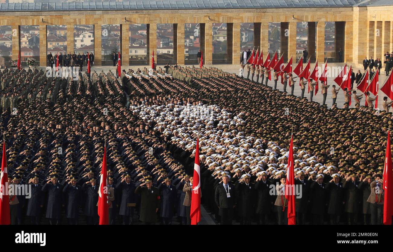 Members of the military attend a ceremony at the mausoleum of the ...