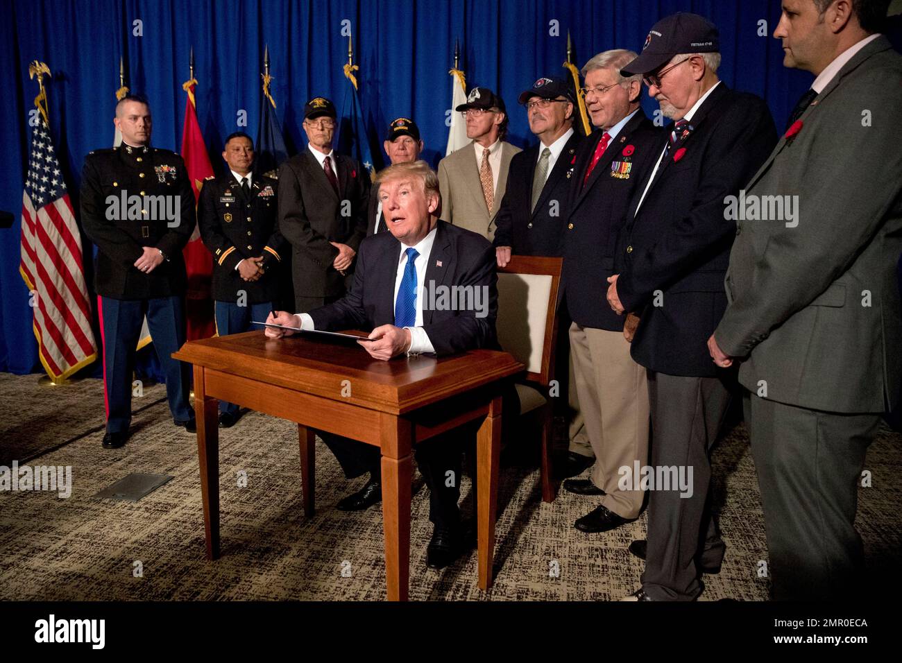 U.S. President Donald Trump signs a proclamation honoring veterans at ...