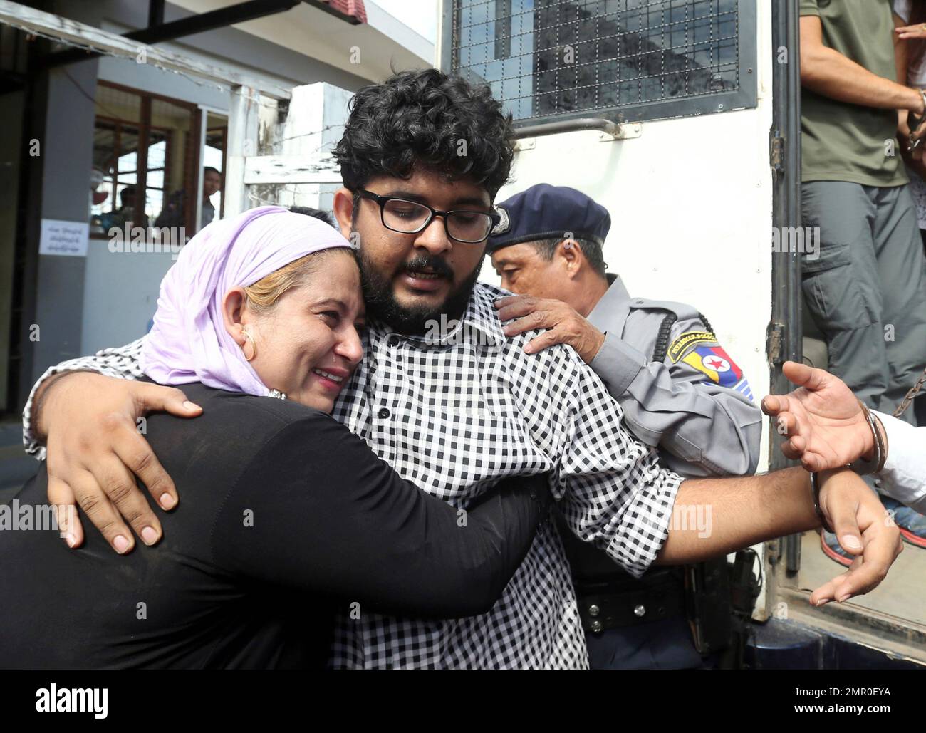 Aung Naing Soe, left, Burmese freelance journalist and interpreter, is ...