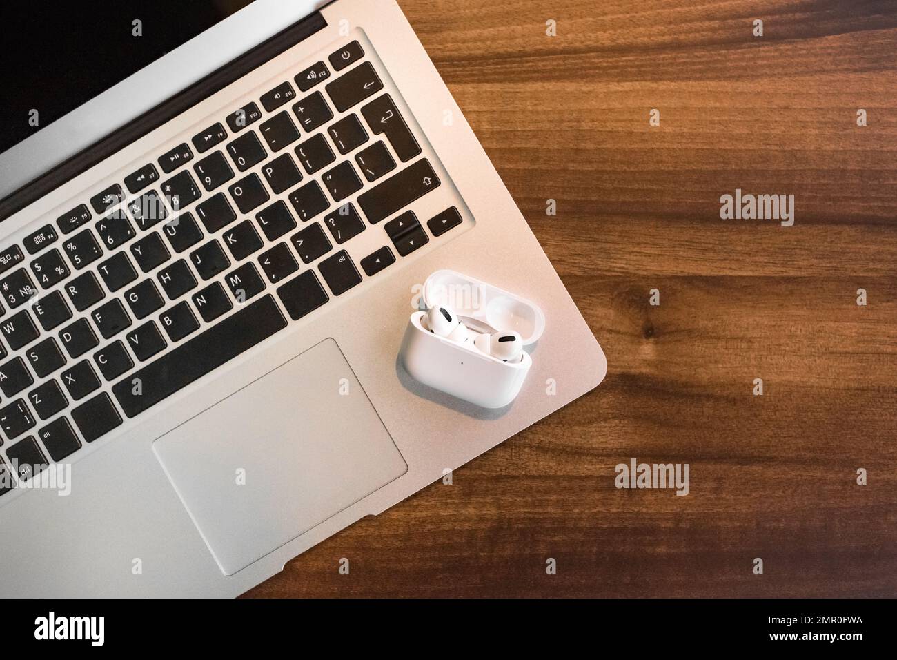 Laptop keyboard wireless headphones, technology desk wooden table ...