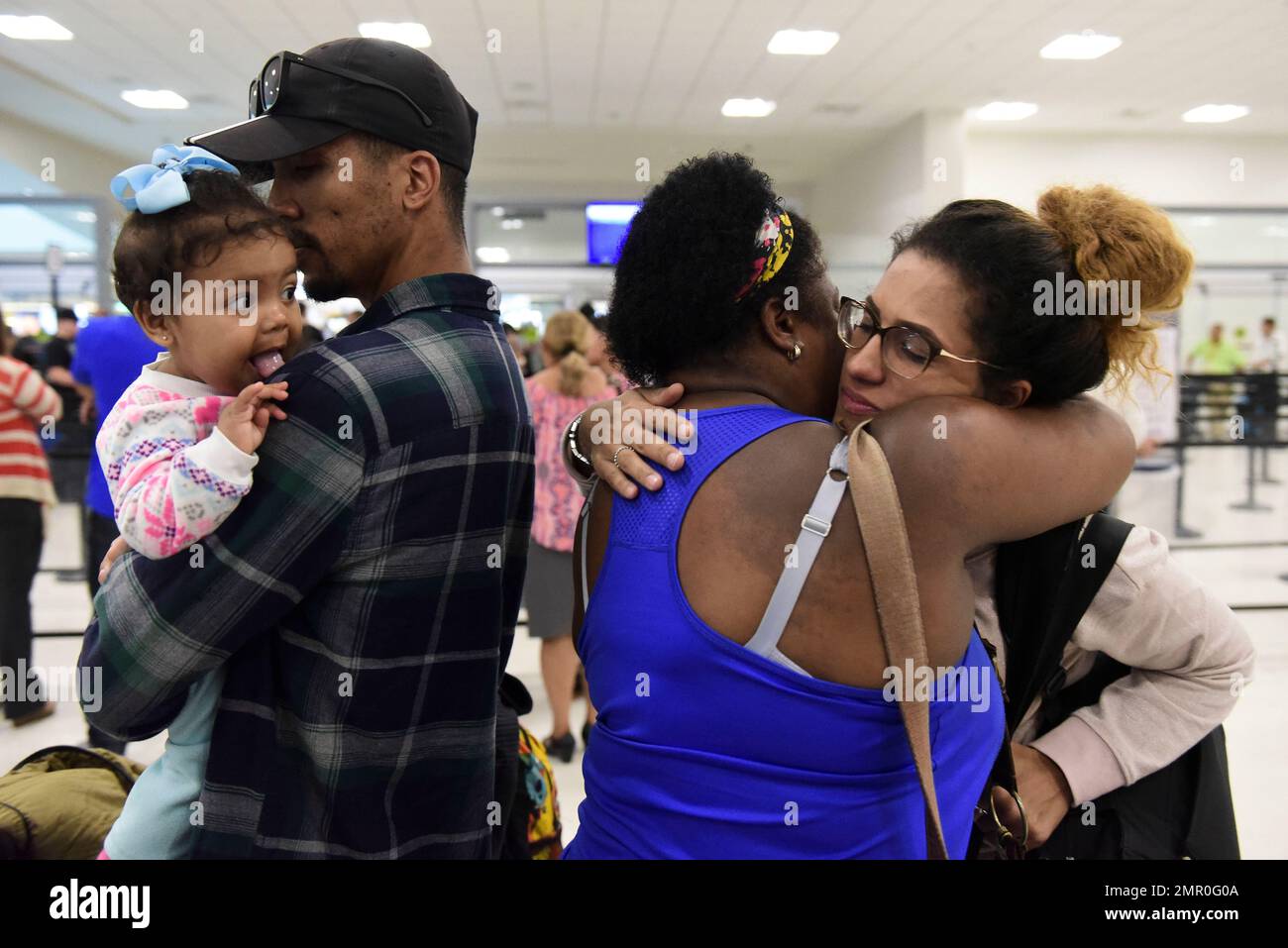 In this Wednesday, Nov. 8, 2017 photo, Waritza Alejandro embraces her ...