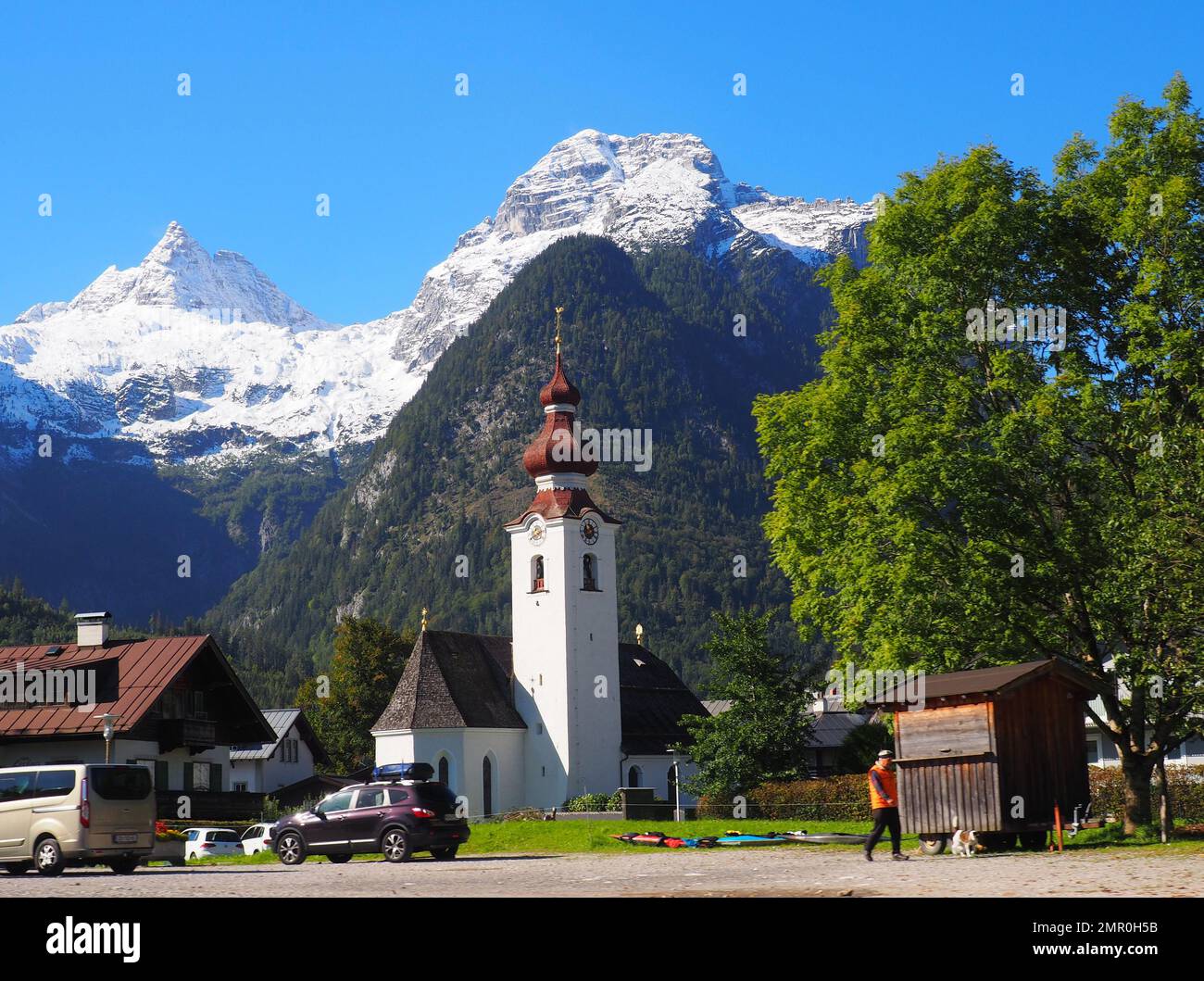 The onion tower church with Alps on the background Stock Photo - Alamy