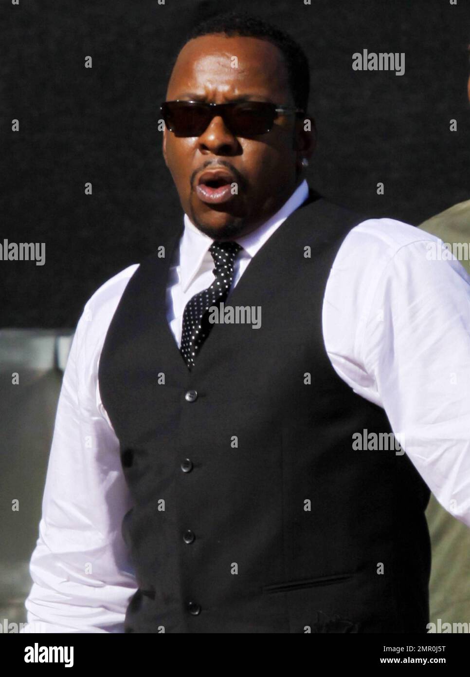 Bobby Brown gives the peace sign as he arrives at the red carpet for ...