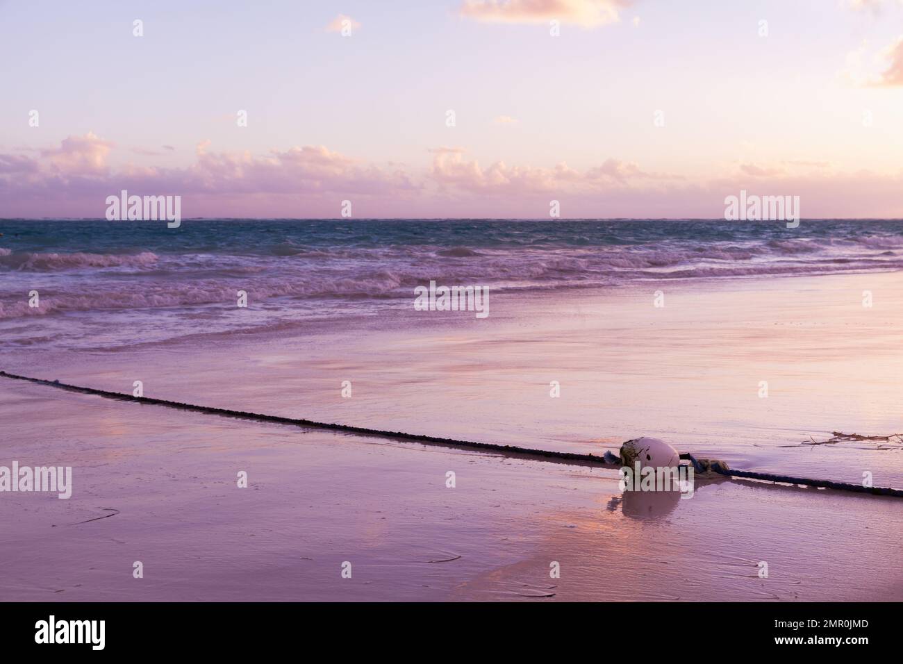 Coastal Caribbean landscape with a float on rope lying on an empty ...