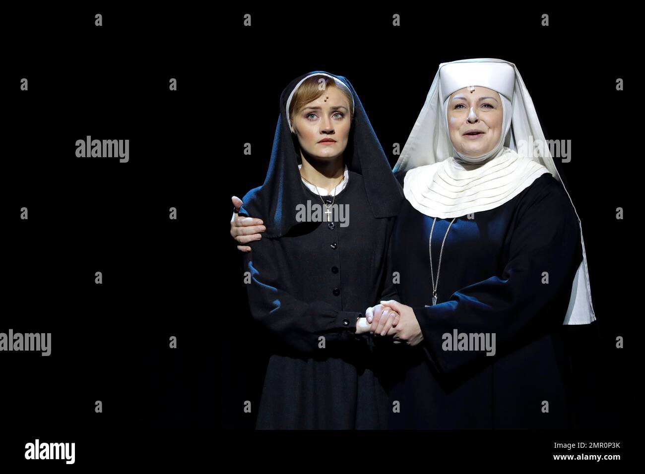 Carmen Pretorius of South Africa, who plays "Maria," left, performs ...