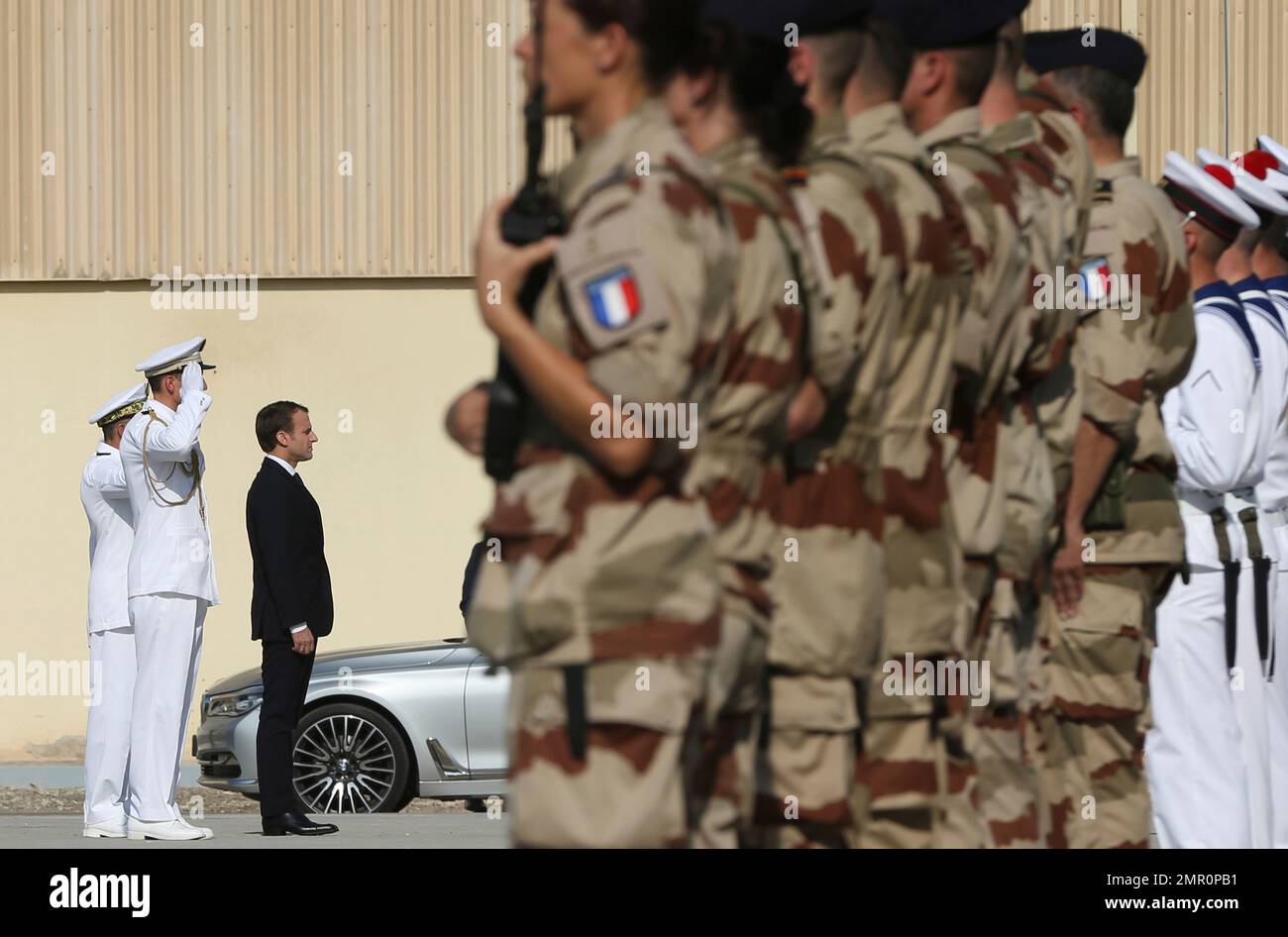 French President Emmanuel Macron views the French honor guard at the ...