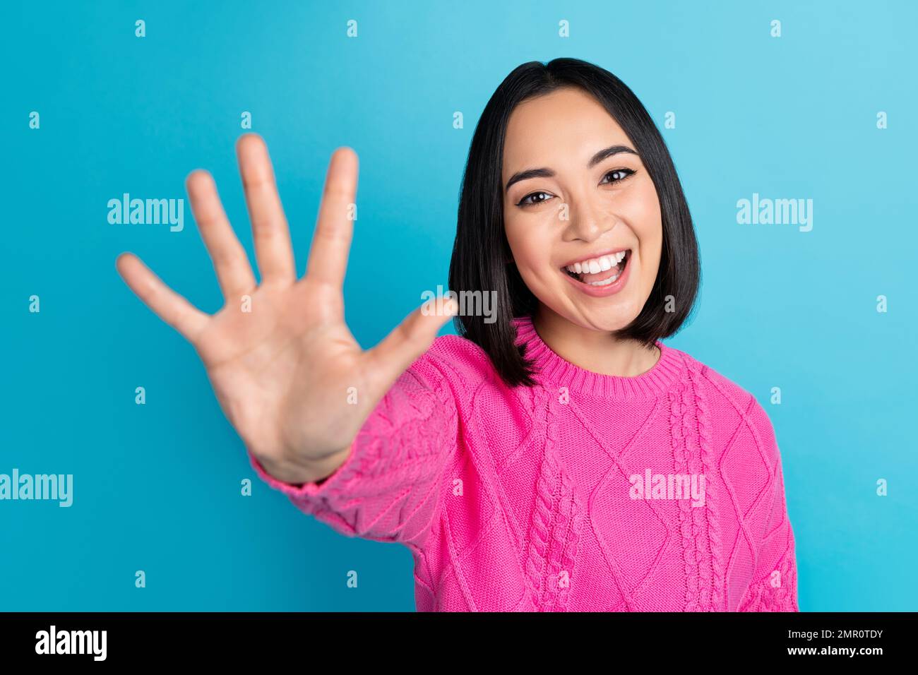 Portrait of pretty friendly malaysian lady arm palm waving hi ...