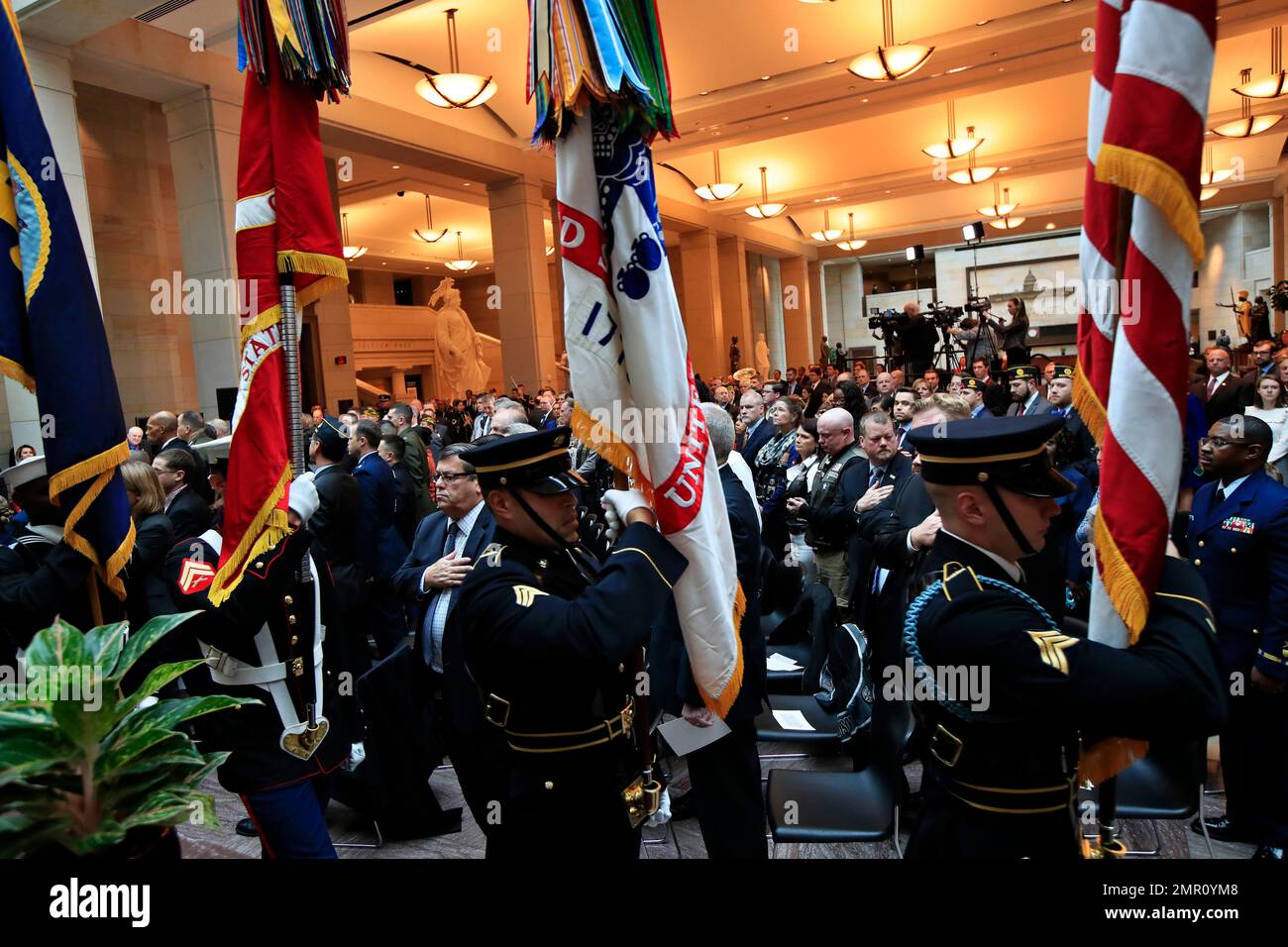 Honor guards retire the colors during a ceremony dedicating and ...