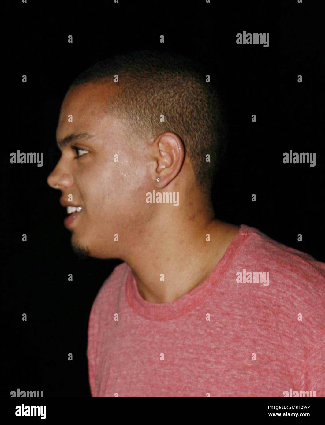 Evan Ross pauses outside the club My House with a cigarette tucked ...