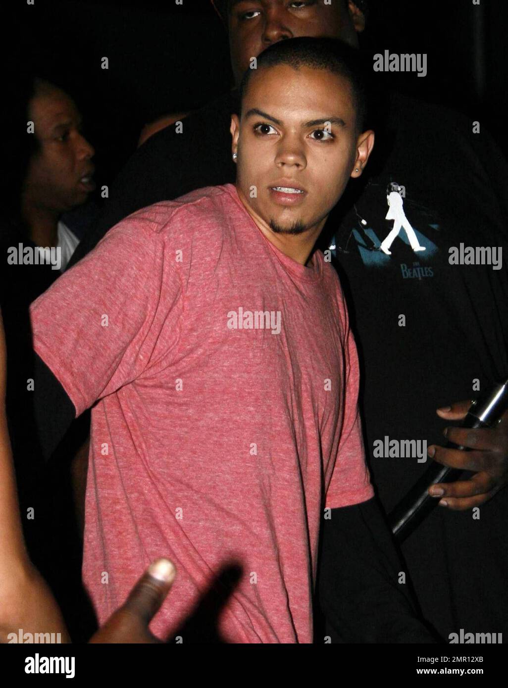 Evan Ross pauses outside the club My House with a cigarette tucked ...