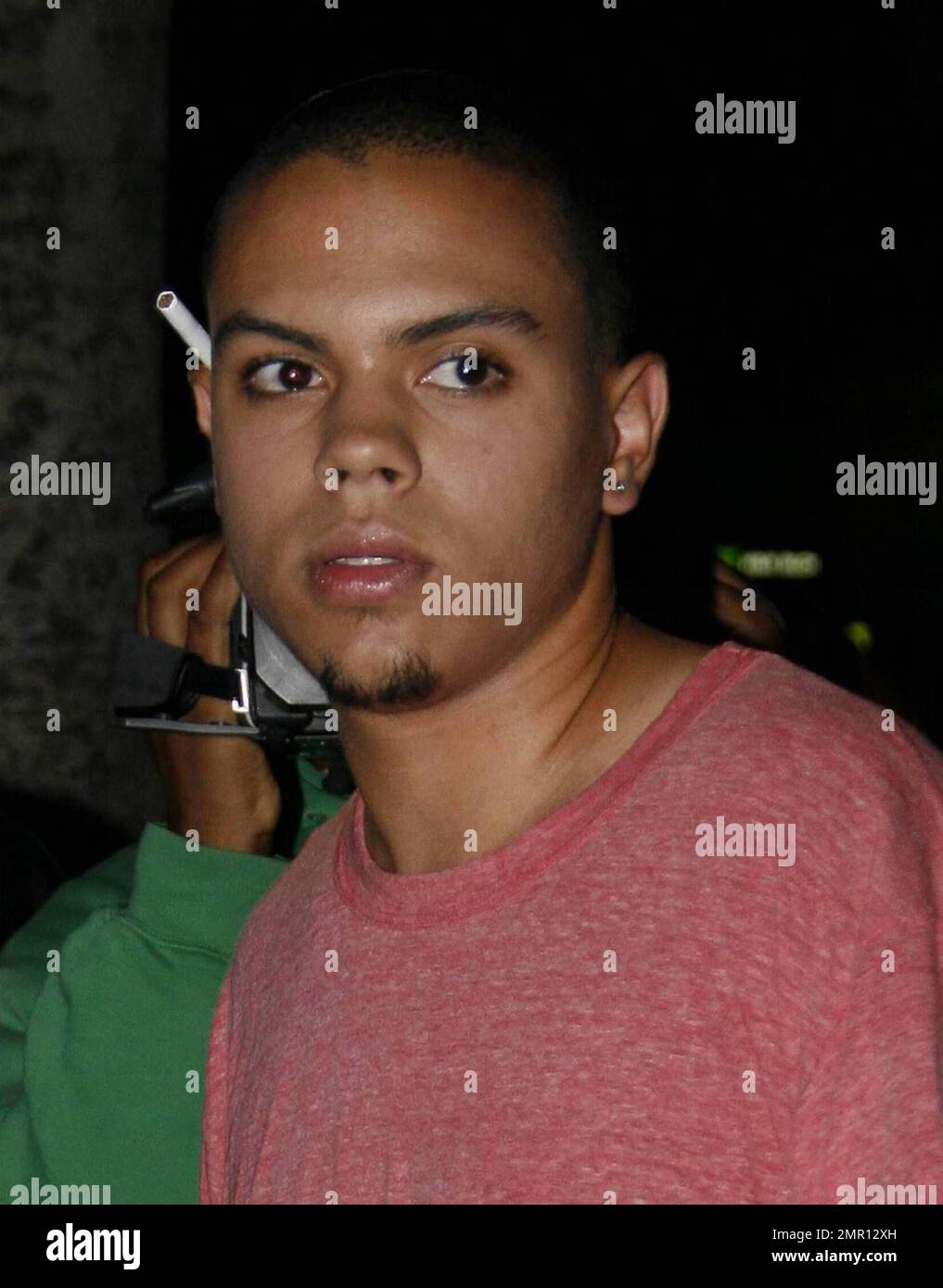 Evan Ross pauses outside the club My House with a cigarette tucked ...