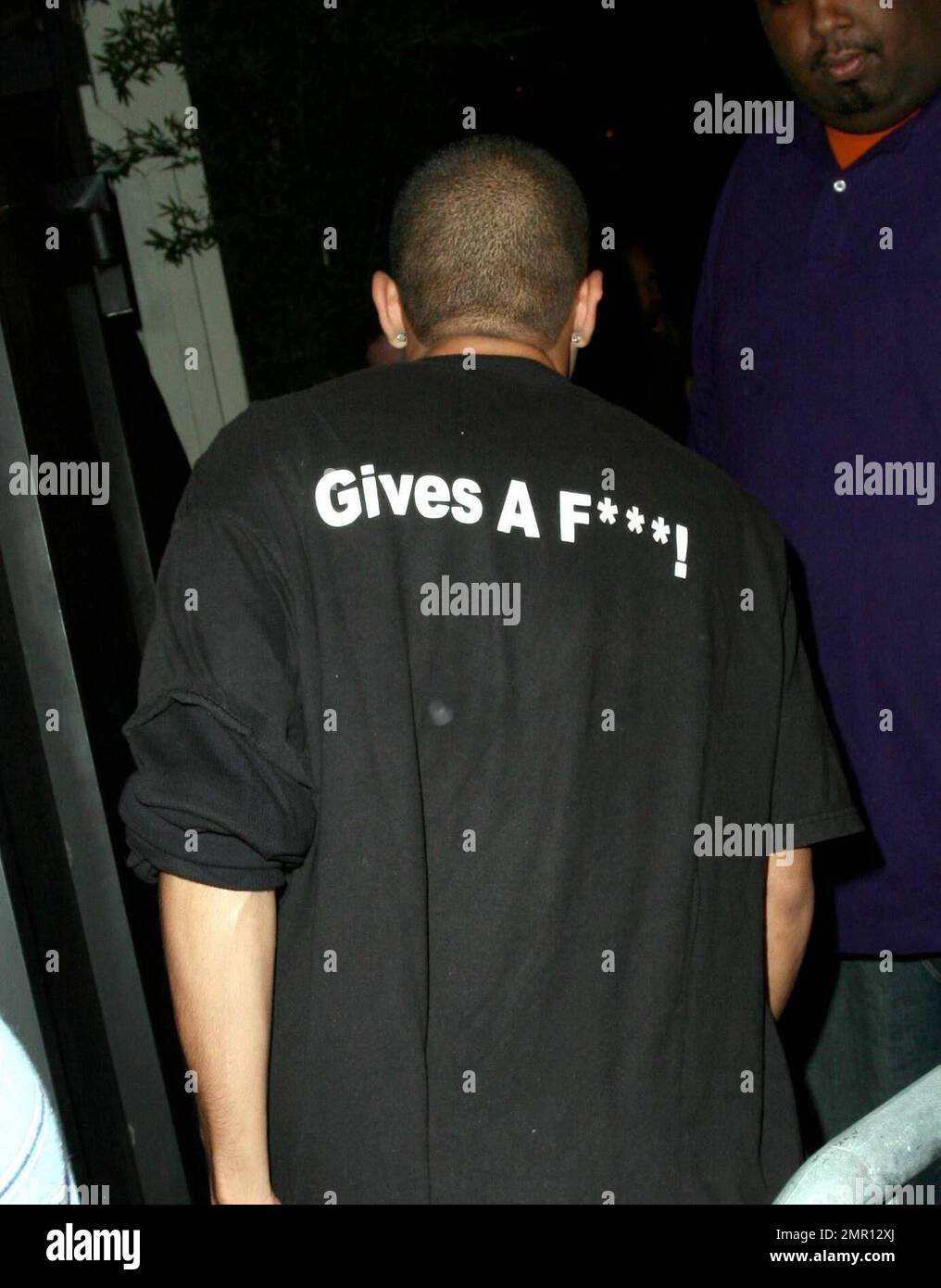 Evan Ross, out for an evening at Coco DeVille wears a shirt that asks ...