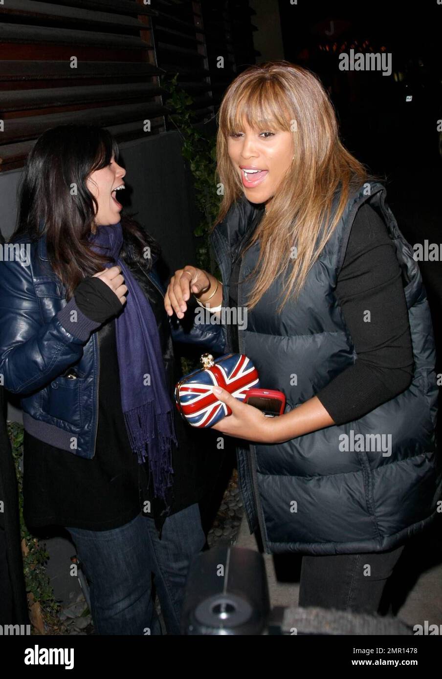 Rapper Eve is all smiles as she arrives for an evening out with friends ...