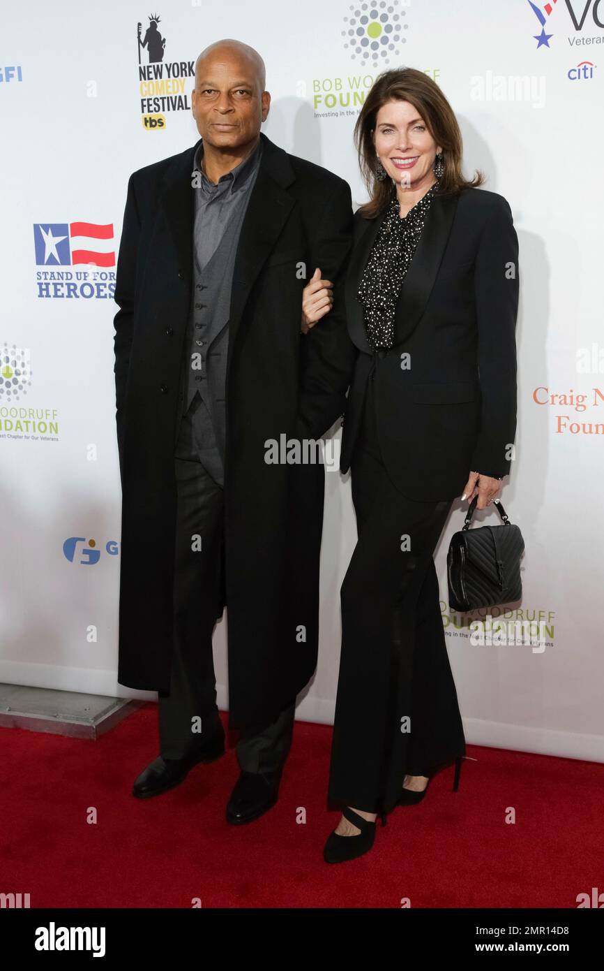 Retired Football player Ronnie Lott, left, and Karen Lott attend the ...