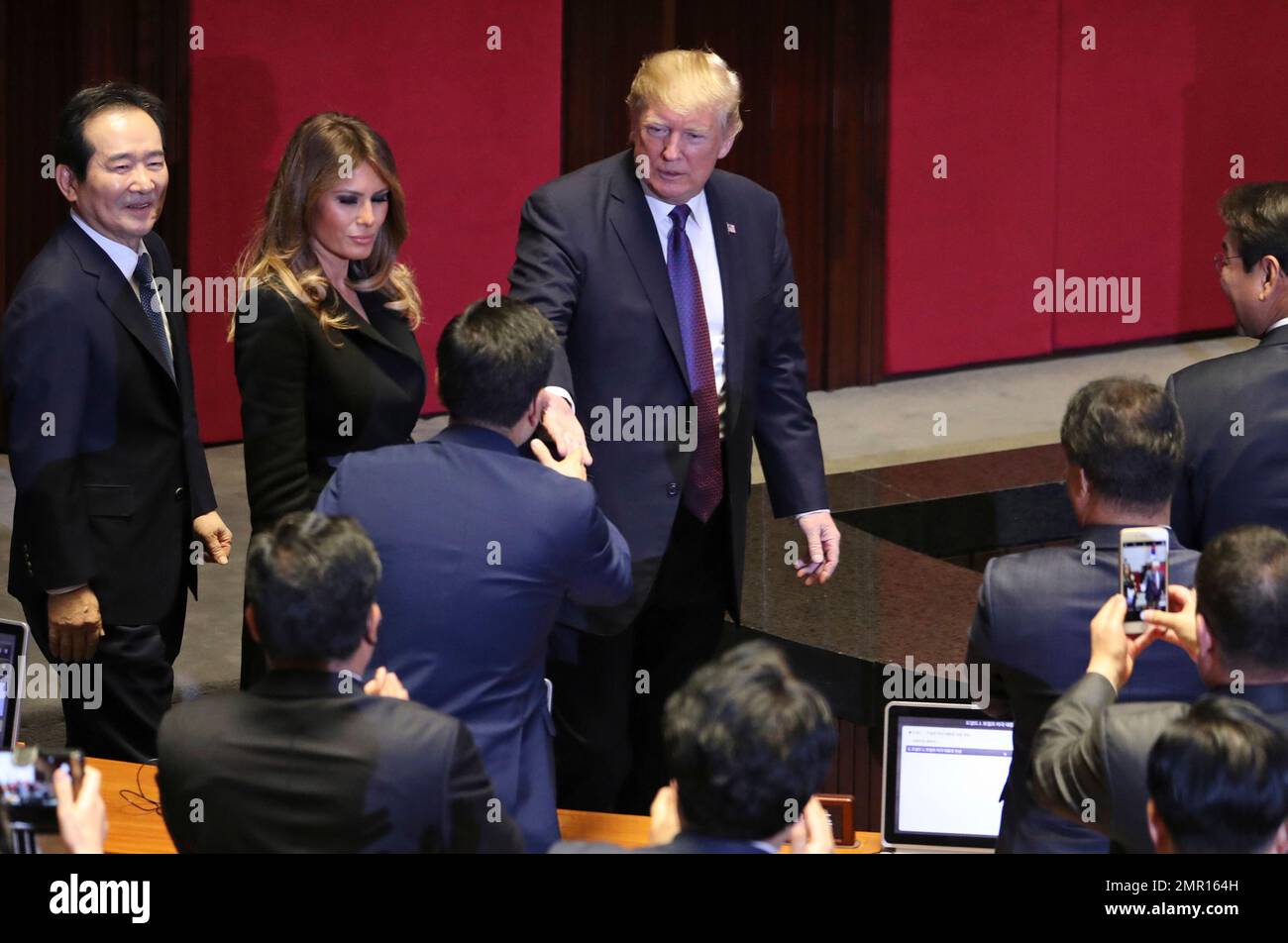President Donald Trump, center, and first lady Melania Trump, center ...