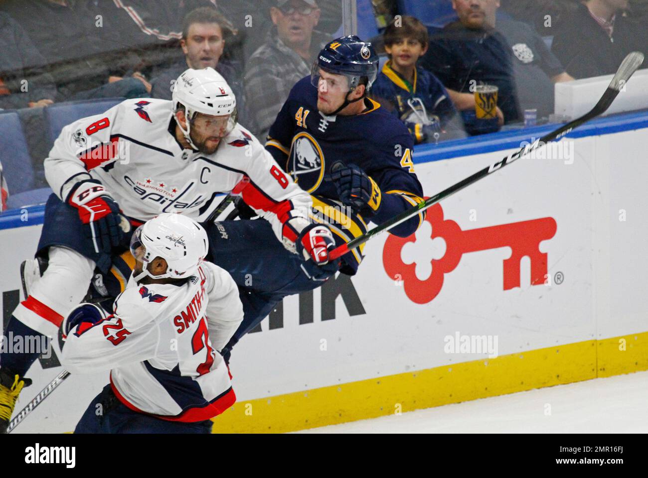 Buffalo Sabres defenseman Justin Falk (41) is hit by Washington ...