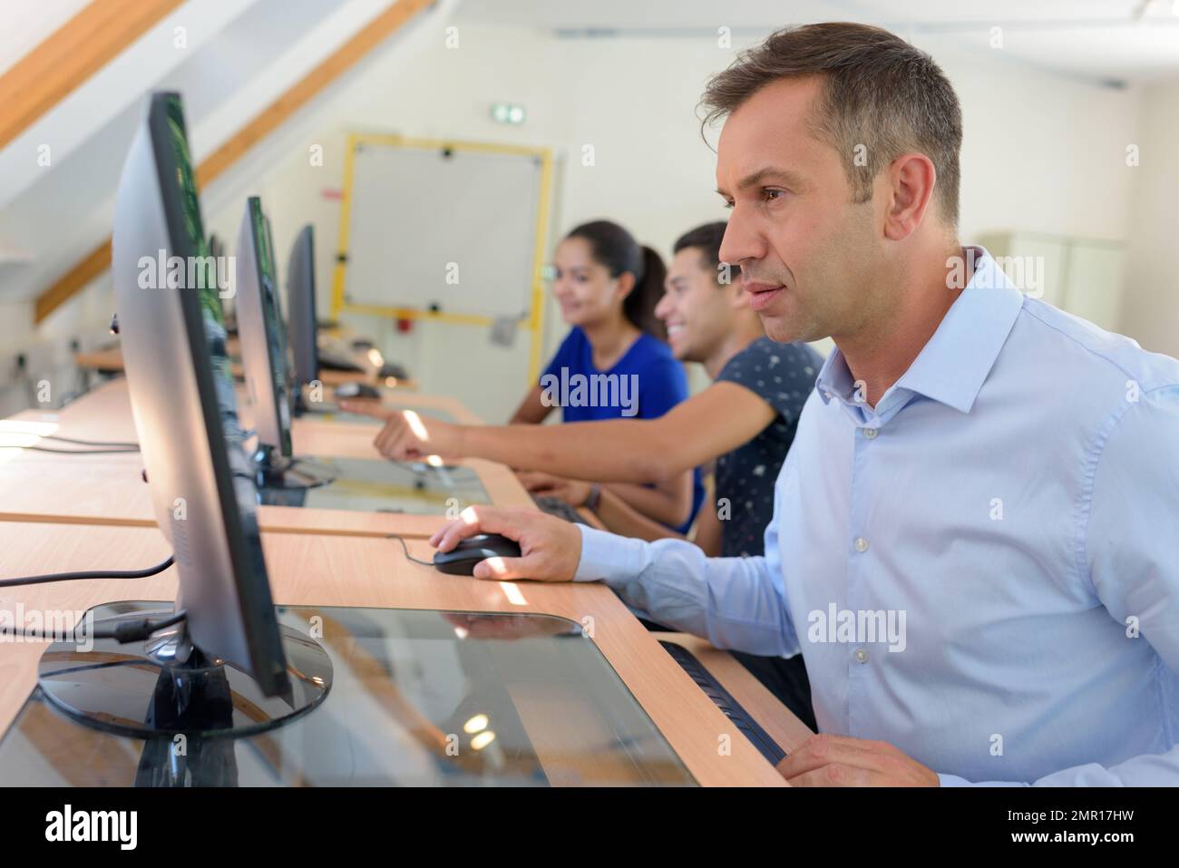 mature man attending computer class Stock Photo - Alamy