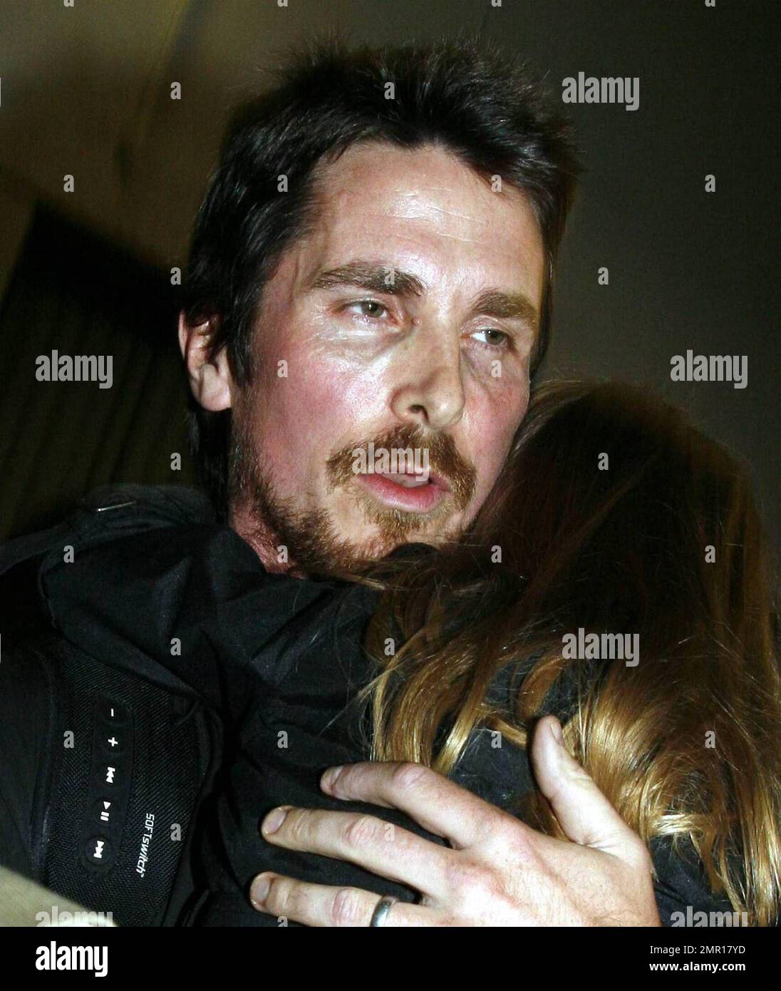 Christian Bale looks exhausted as he arrives at LAX after a long flight ...