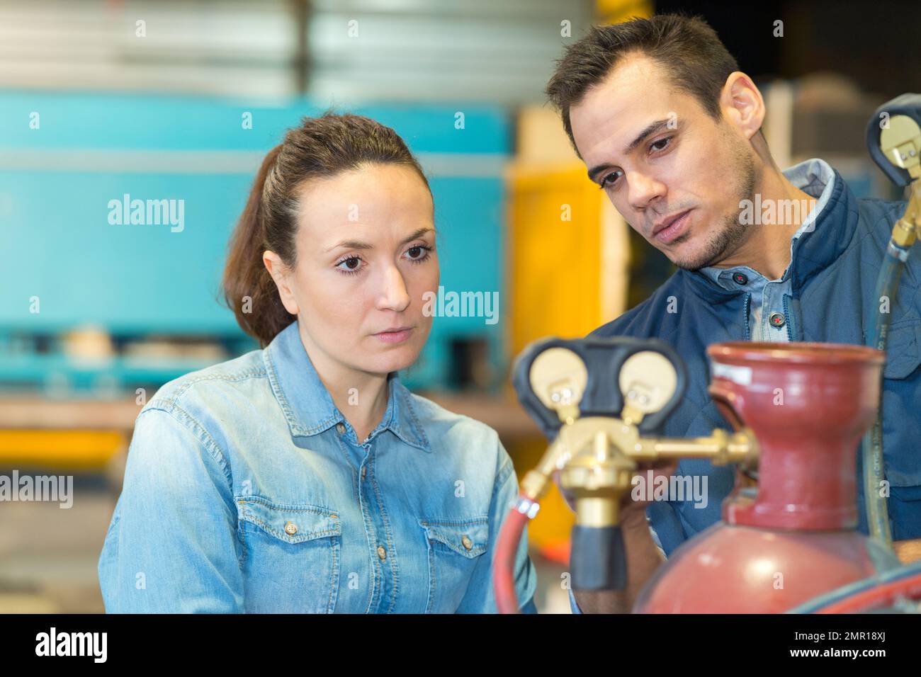 manager is showing task to the worker in a warehouse Stock Photo - Alamy
