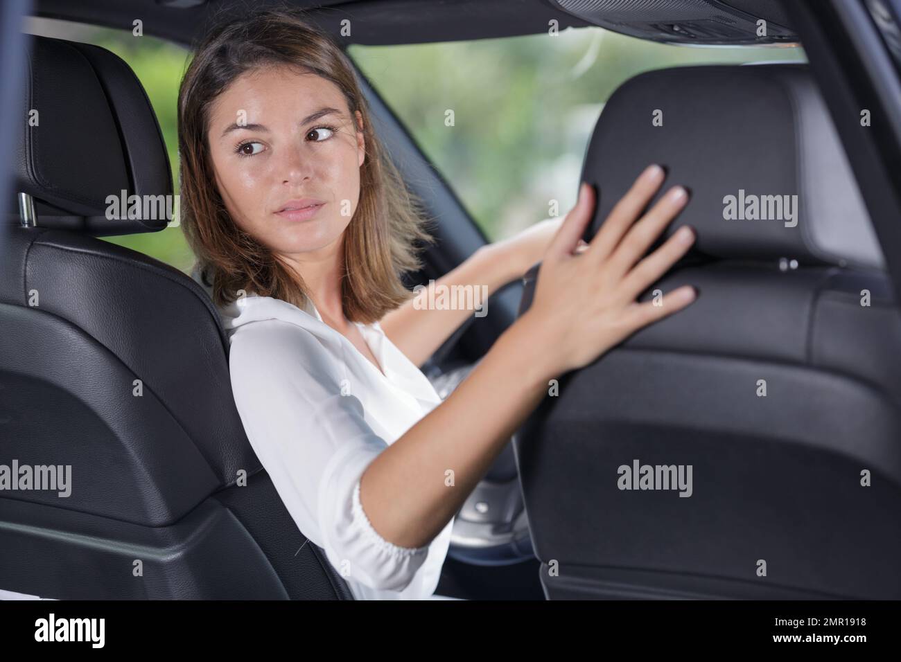 woman driving a car in reverse Stock Photo - Alamy