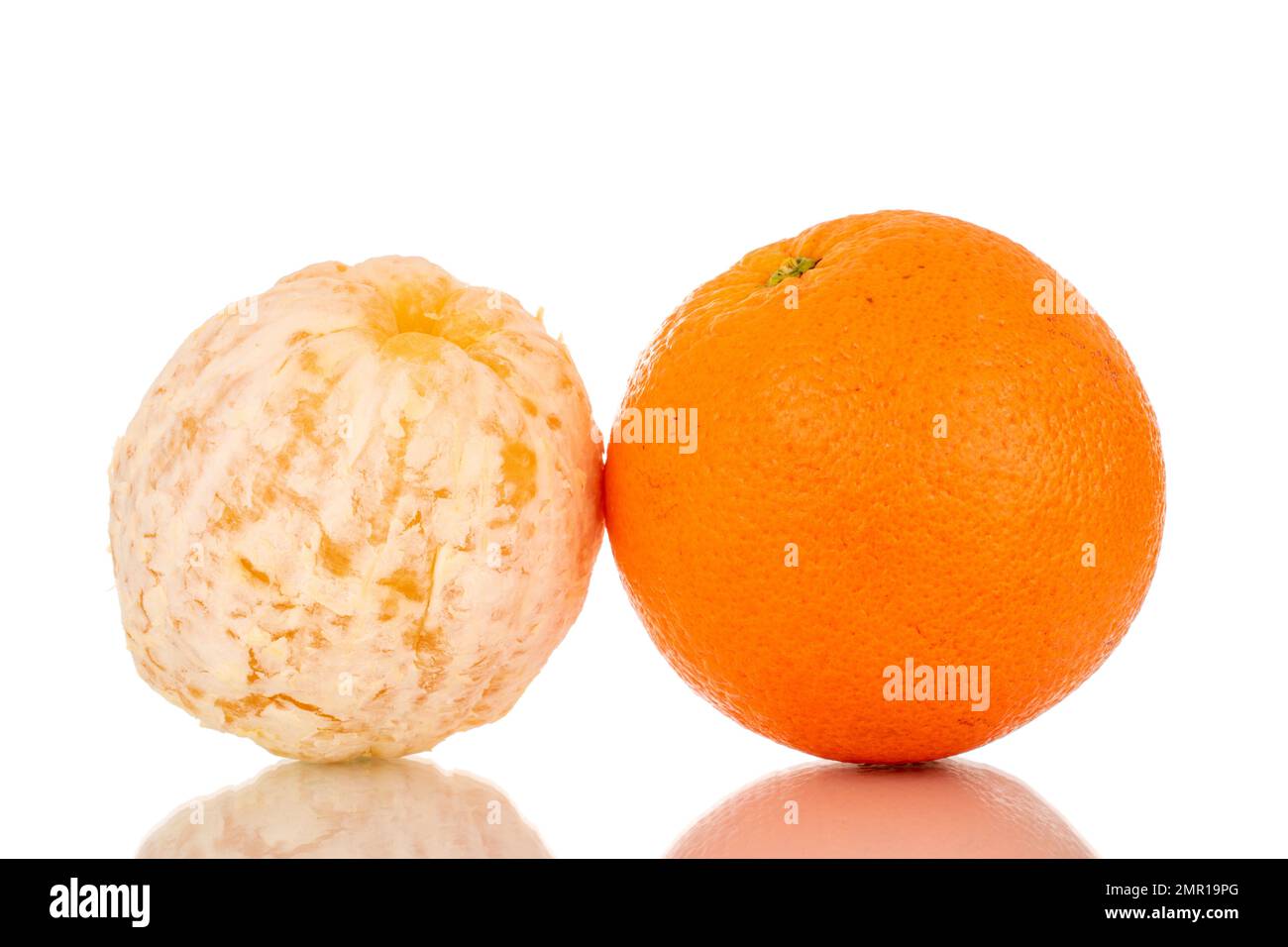 One peeled orange and one unpeeled, macro, isolated on white background ...