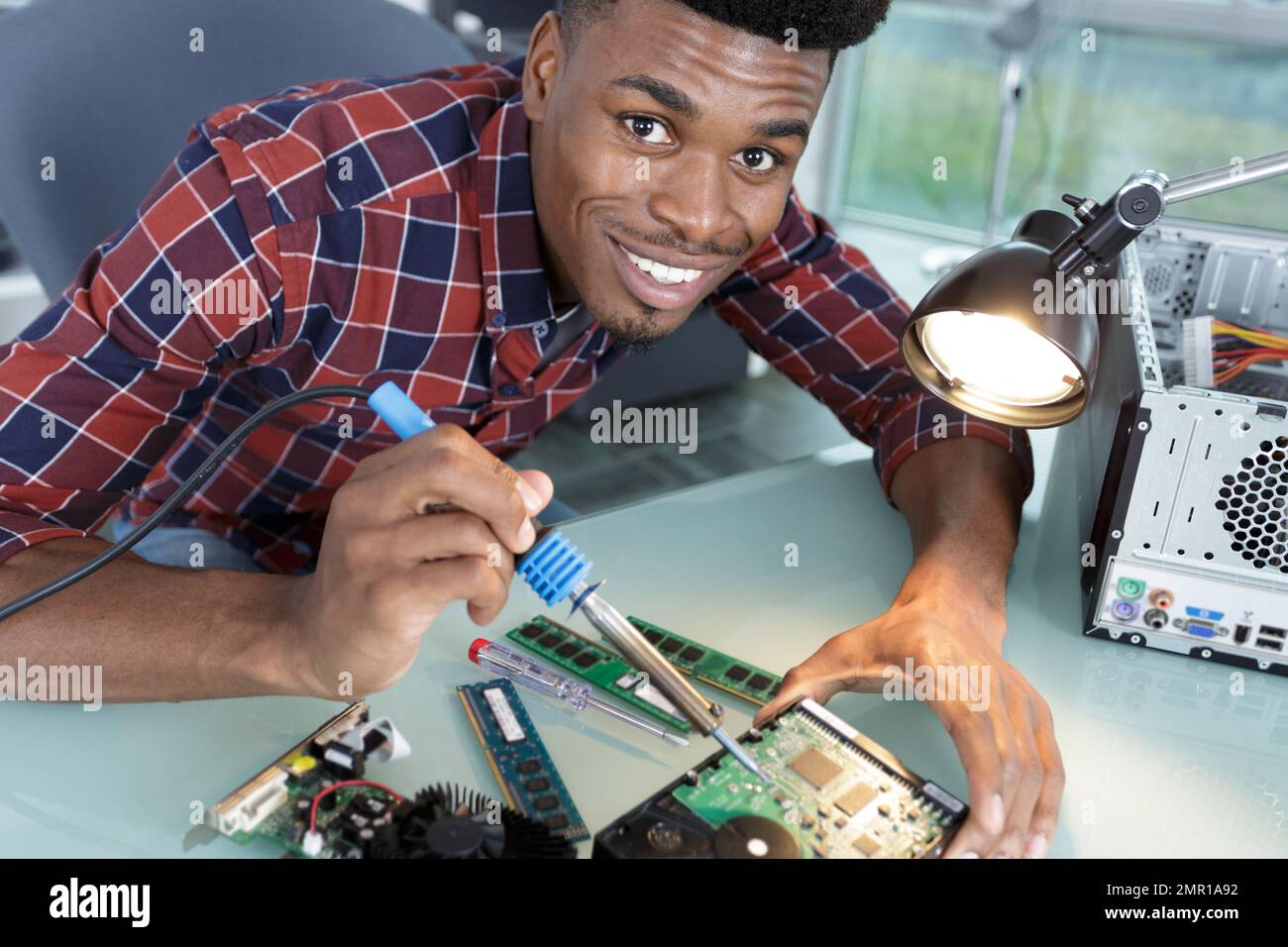hardware engineer soldering pc parts Stock Photo - Alamy