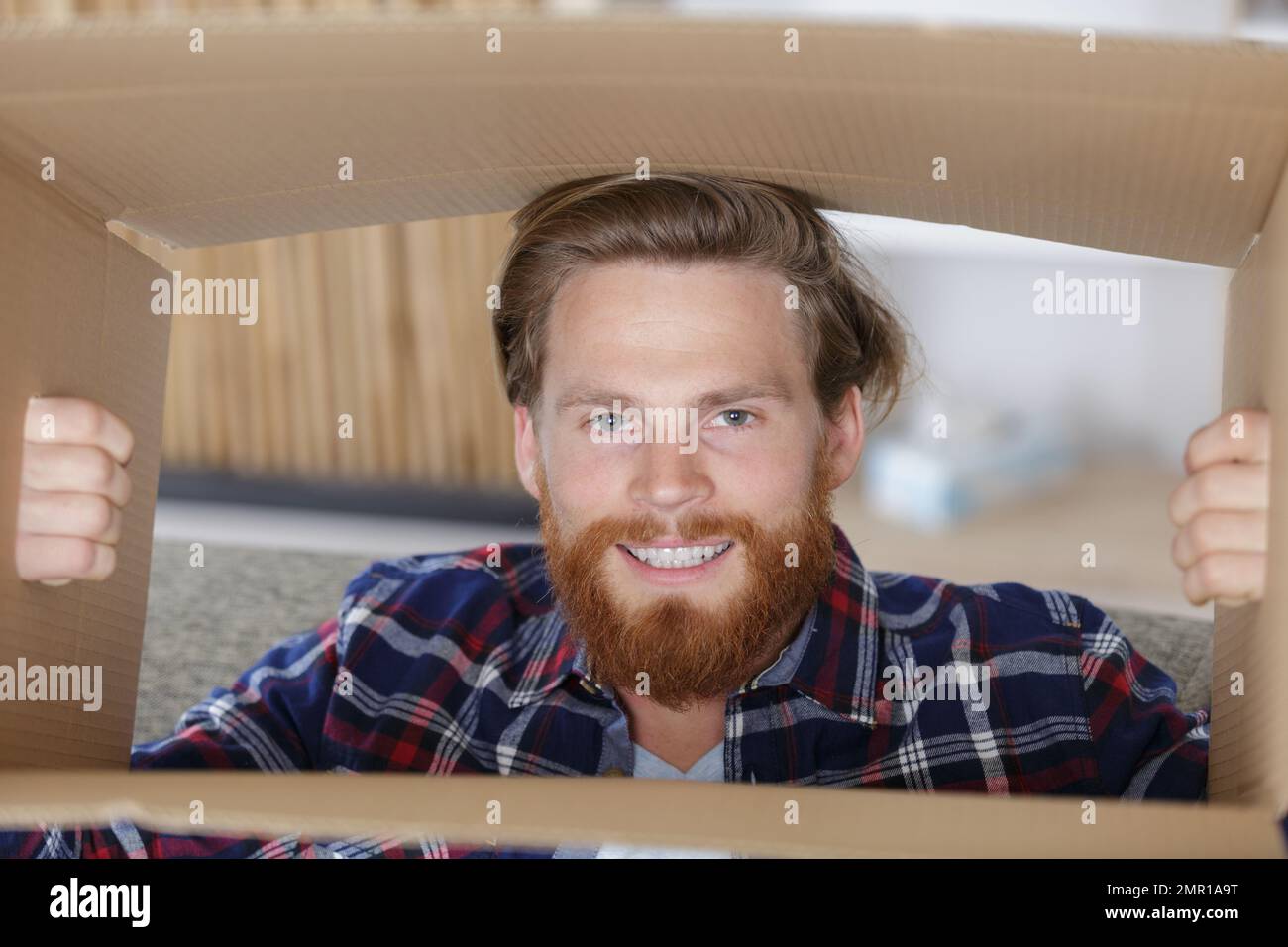 man hides his face inside a cardboard box Stock Photo - Alamy