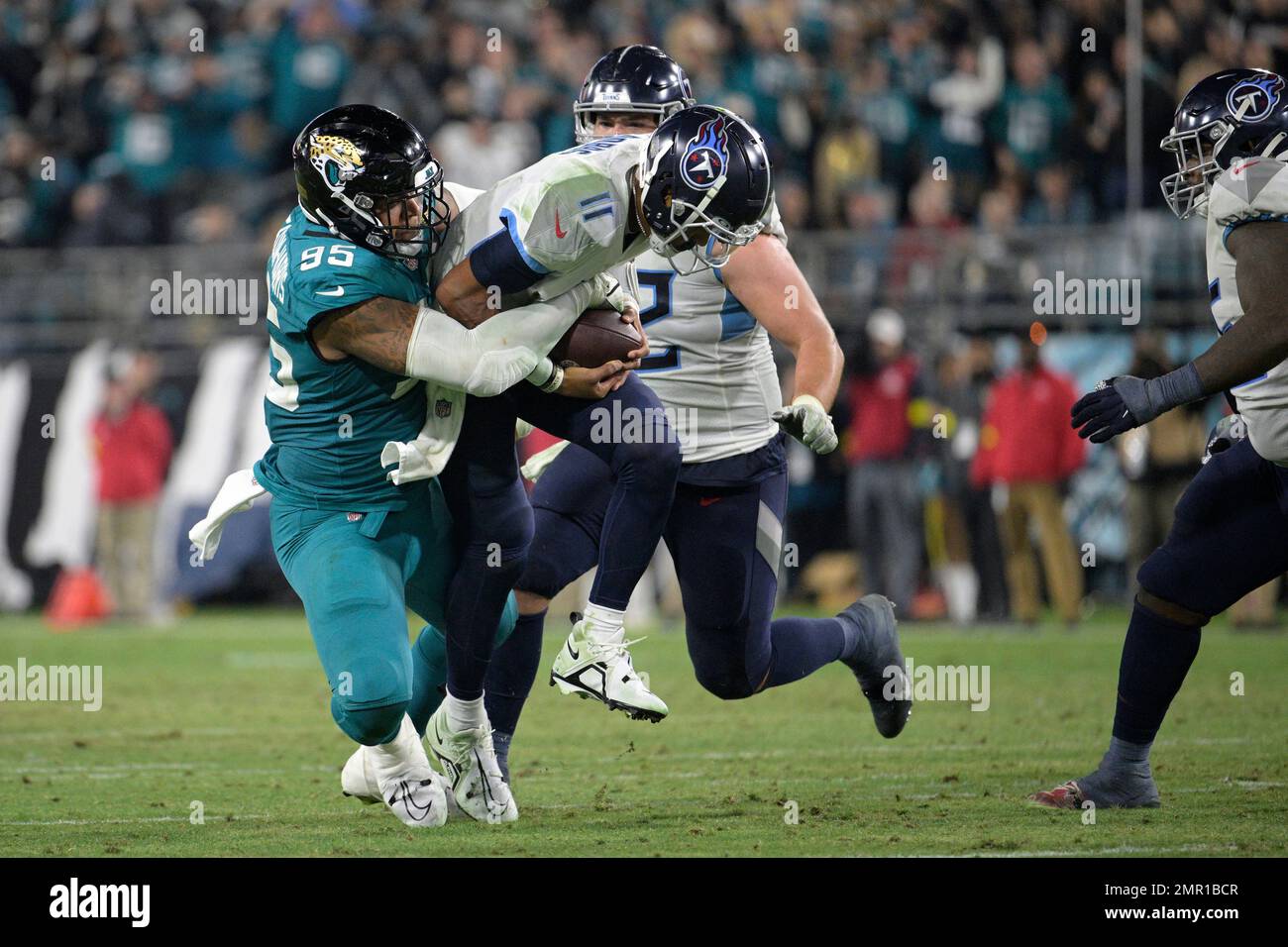 Tennessee Titans quarterback Joshua Dobbs (11) is sacked by ...