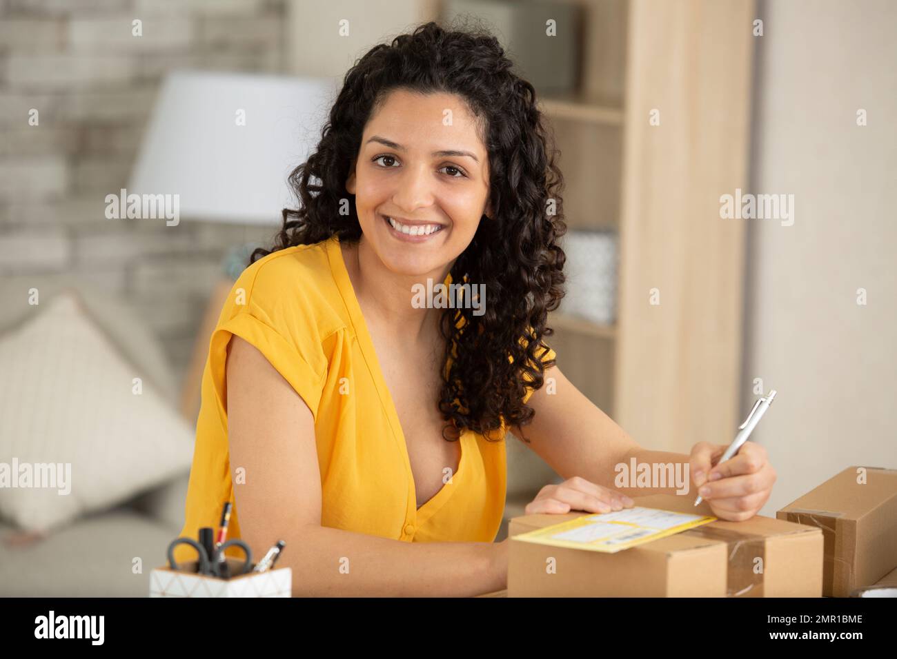 to do list with young woman holding a pencil Stock Photo - Alamy