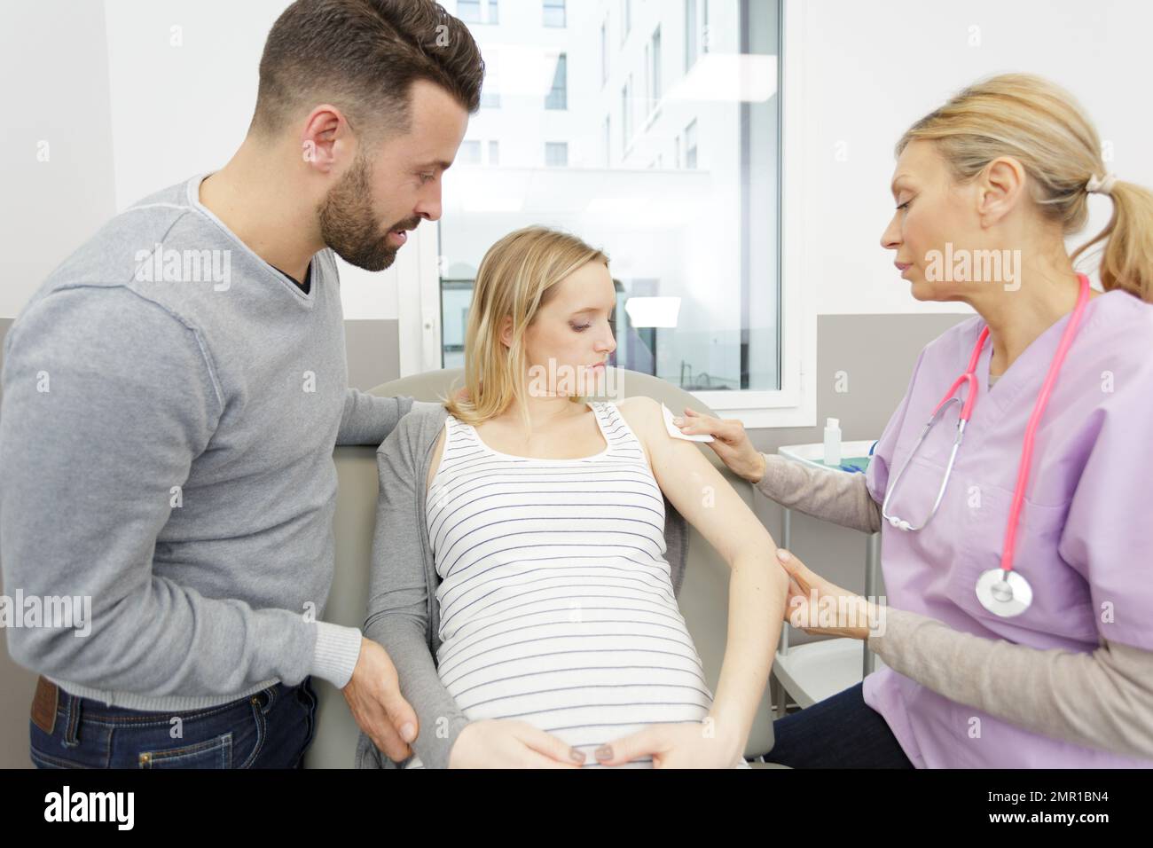 doctor consulting patients on partner childbirth Stock Photo - Alamy