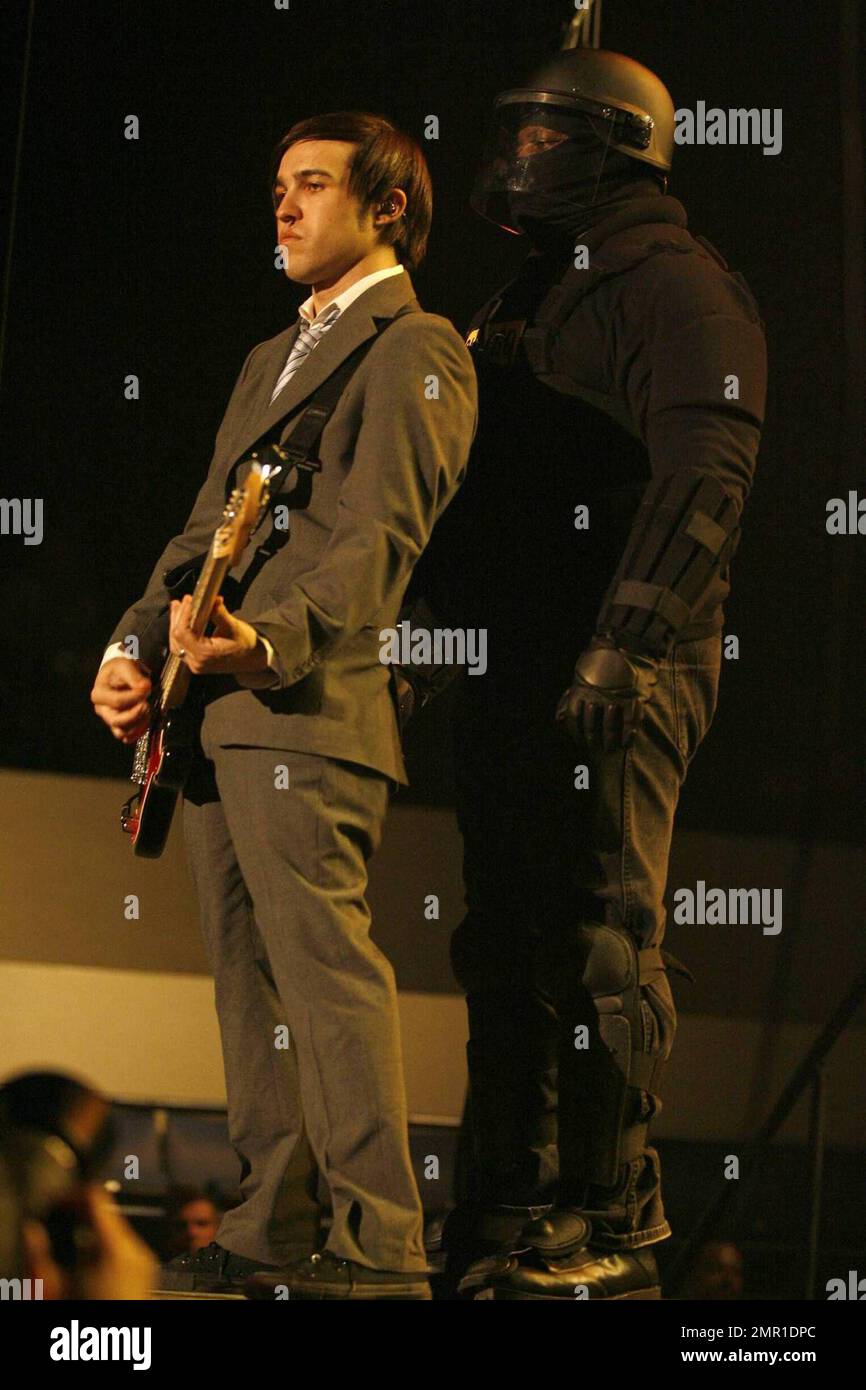 Fall Out Boy appear to be made up to look beaten up as they perform at ...