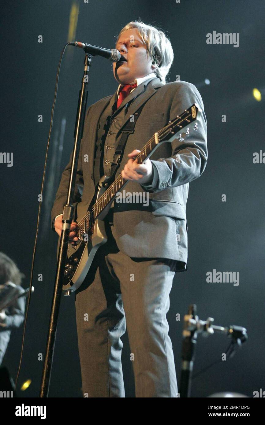 Fall Out Boy appear to be made up to look beaten up as they perform at ...