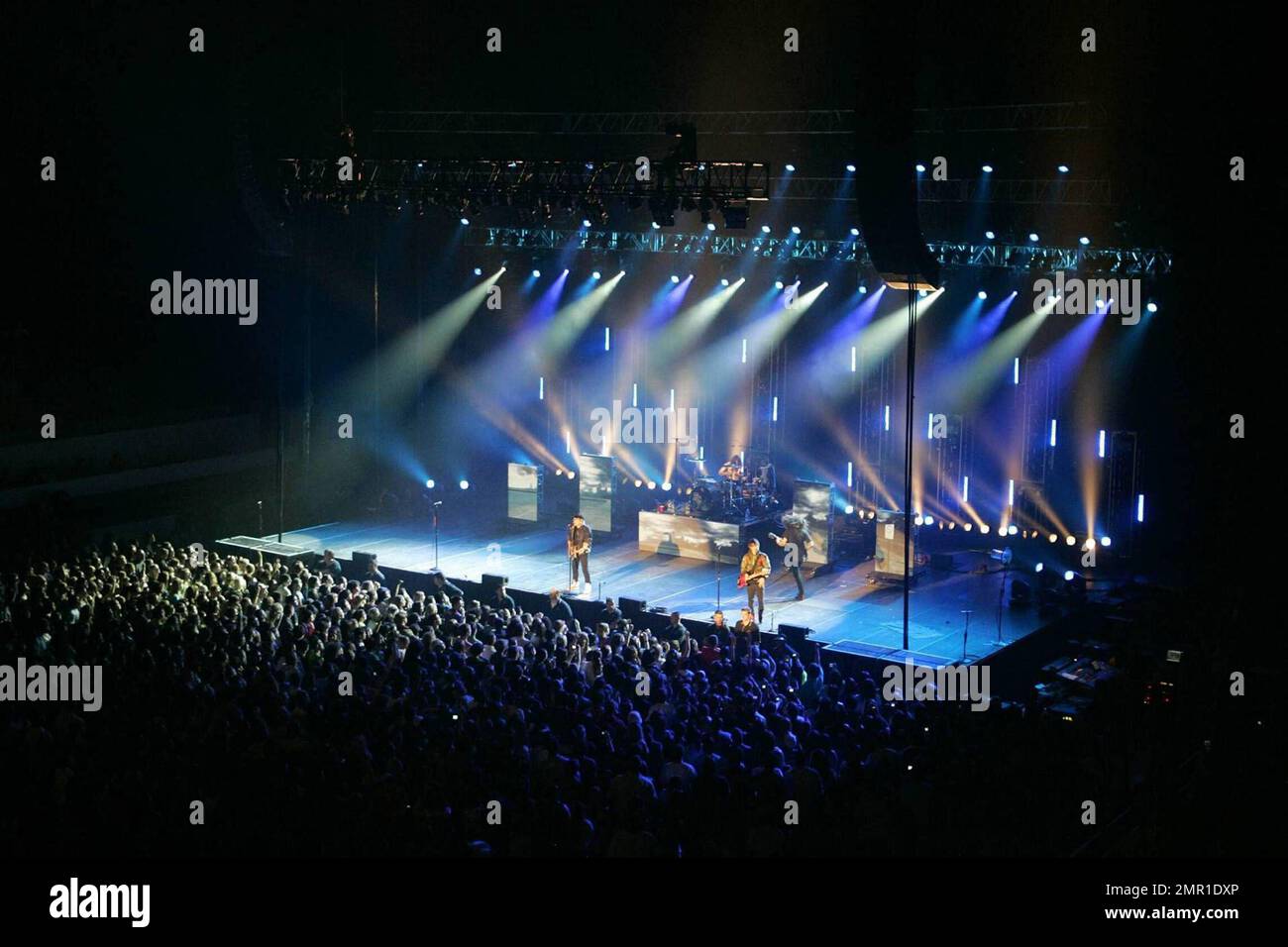 Fall Out Boy appear to be made up to look beaten up as they perform at ...