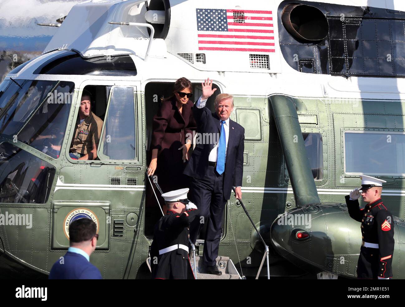 U.S. President Donald Trump, top waving, and first lady Melania Trump ...