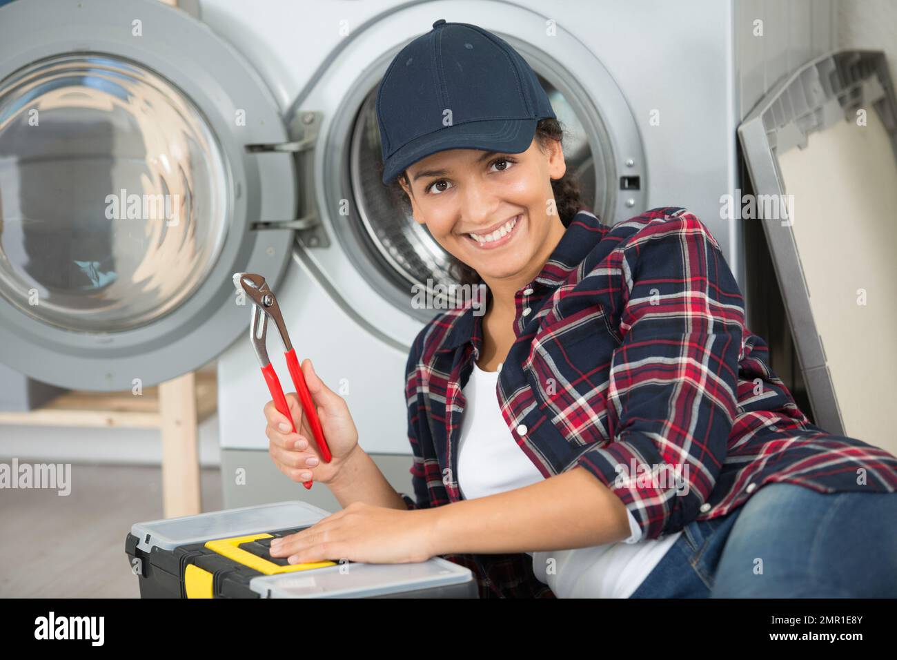 Repair washing machine hi-res stock photography and images - Alamy