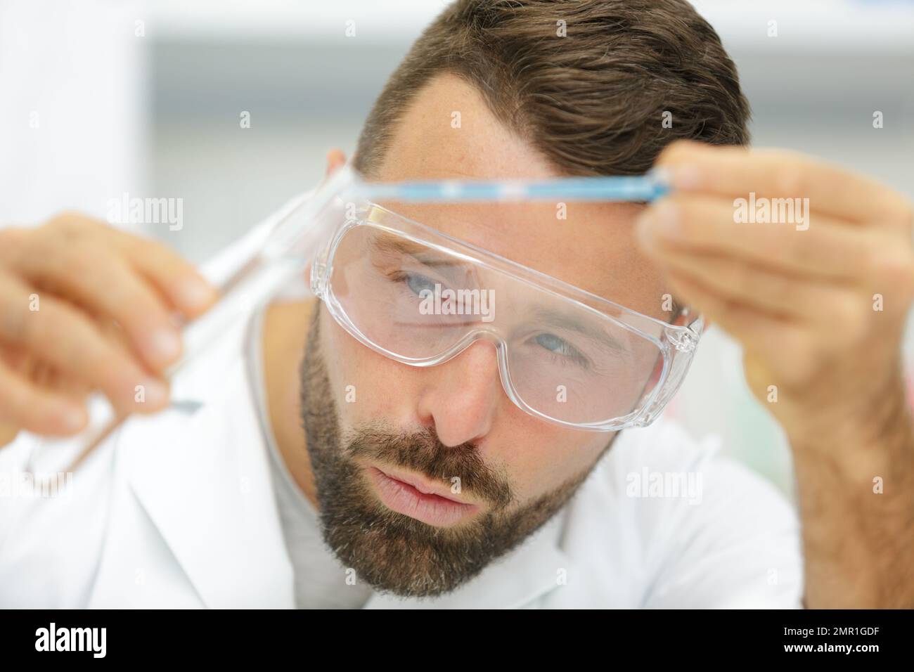 microbiology analyst working with pipette in laboratory Stock Photo - Alamy