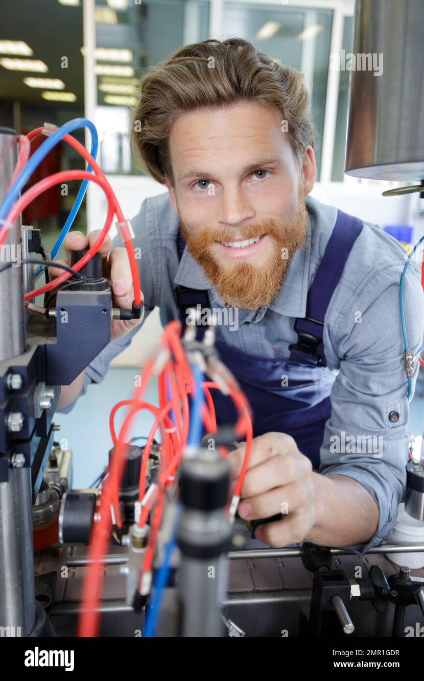 male engineer checking the electrical system of a factory Stock Photo ...