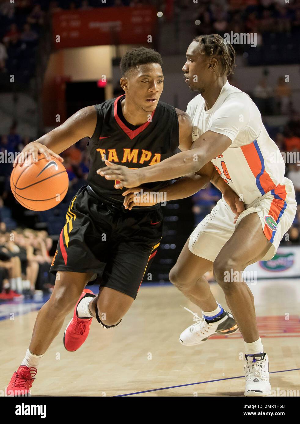 Tampa forward Marcel Robinson (11) dribbles against the defense of ...