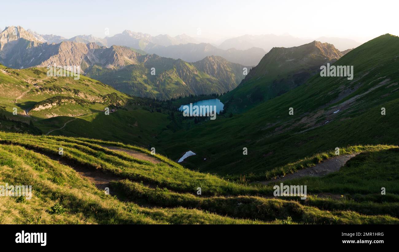 An aerial view of greenery mountain landscape with lake Stock Photo - Alamy