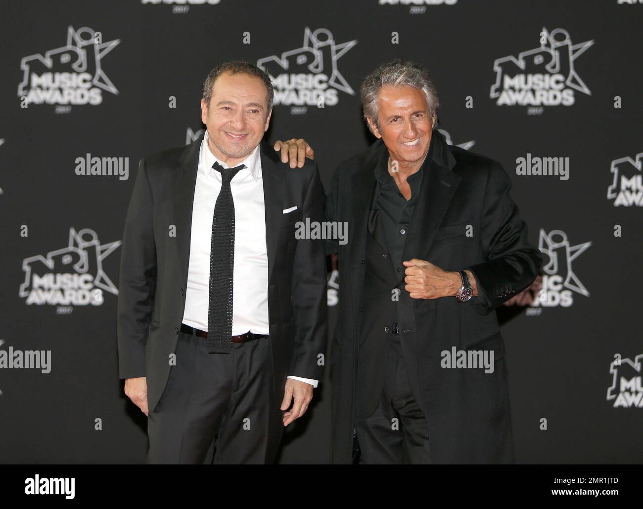 French actors Patrick Timsit, left, and Richard Anconina pose before ...