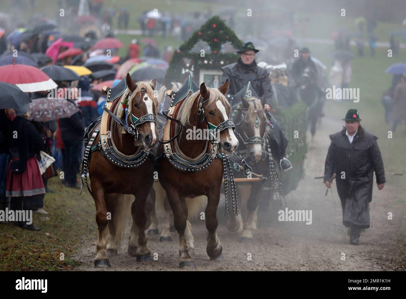 Horsemen steer their carriages over a rain-sodden meadow during the ...