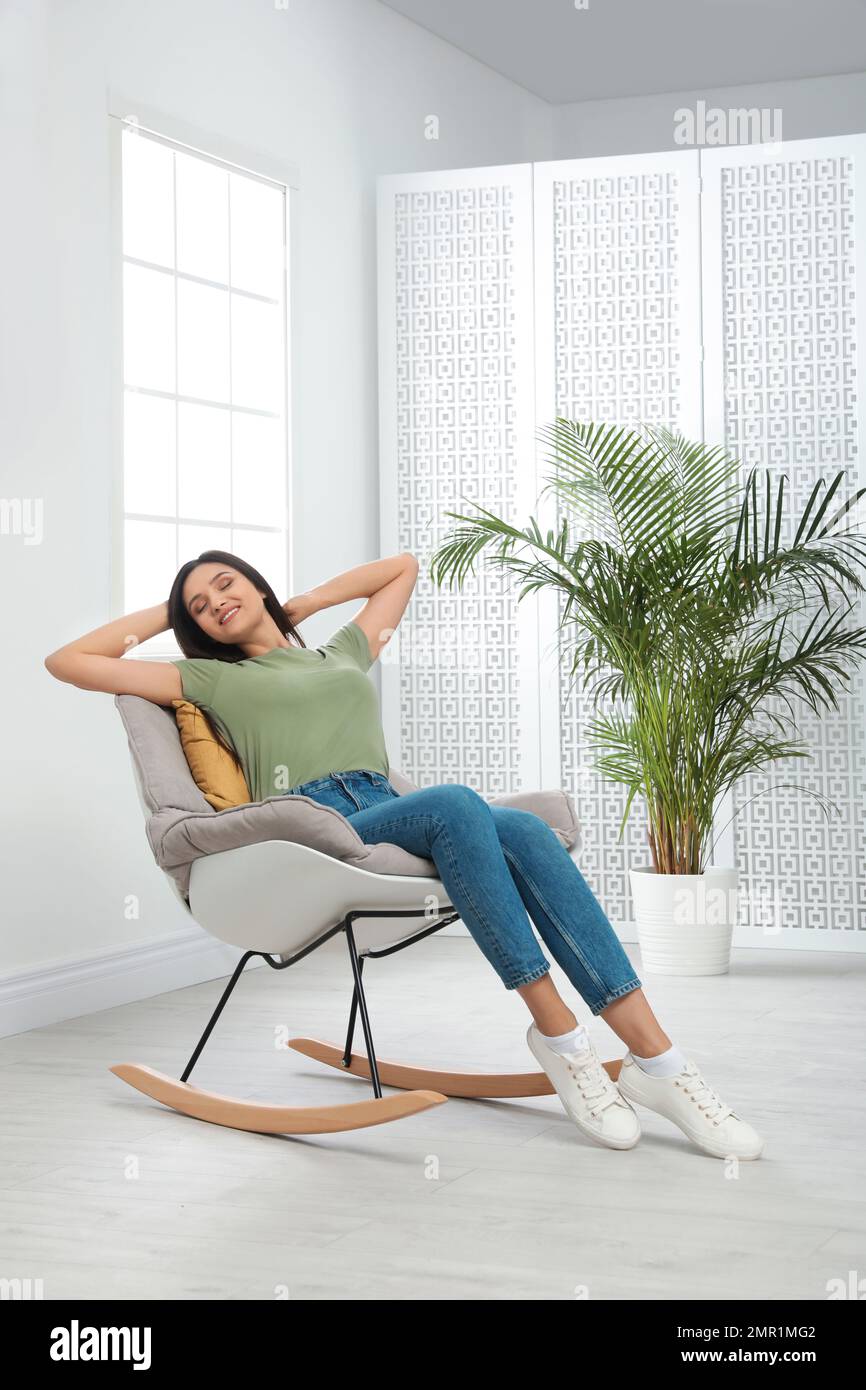 Girl sitting in rocking chair hi-res stock photography and images - Alamy
