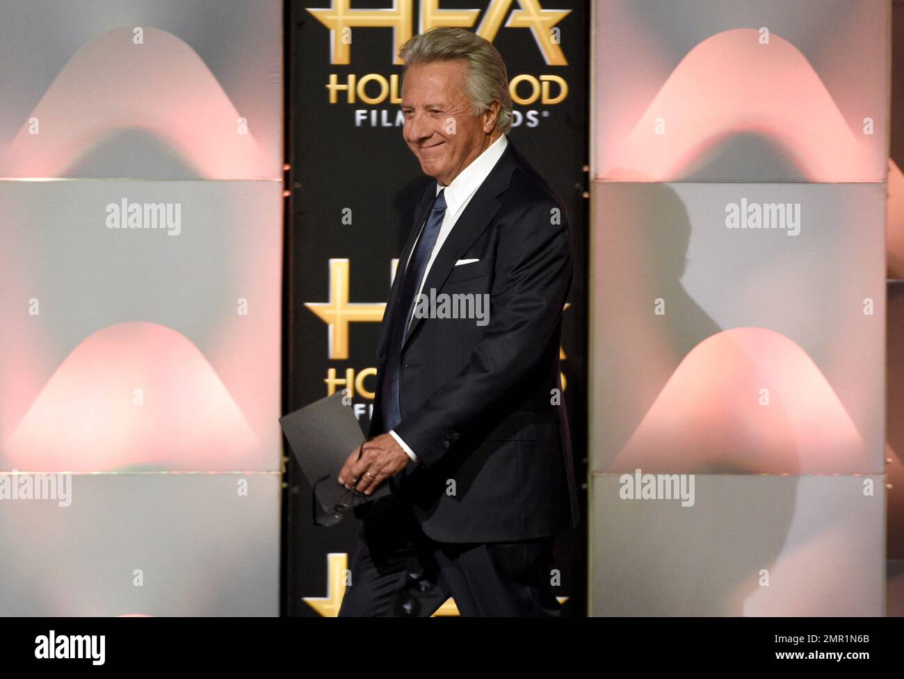 Dustin Hoffman walks on stage to present the Hollywood comedy award at ...