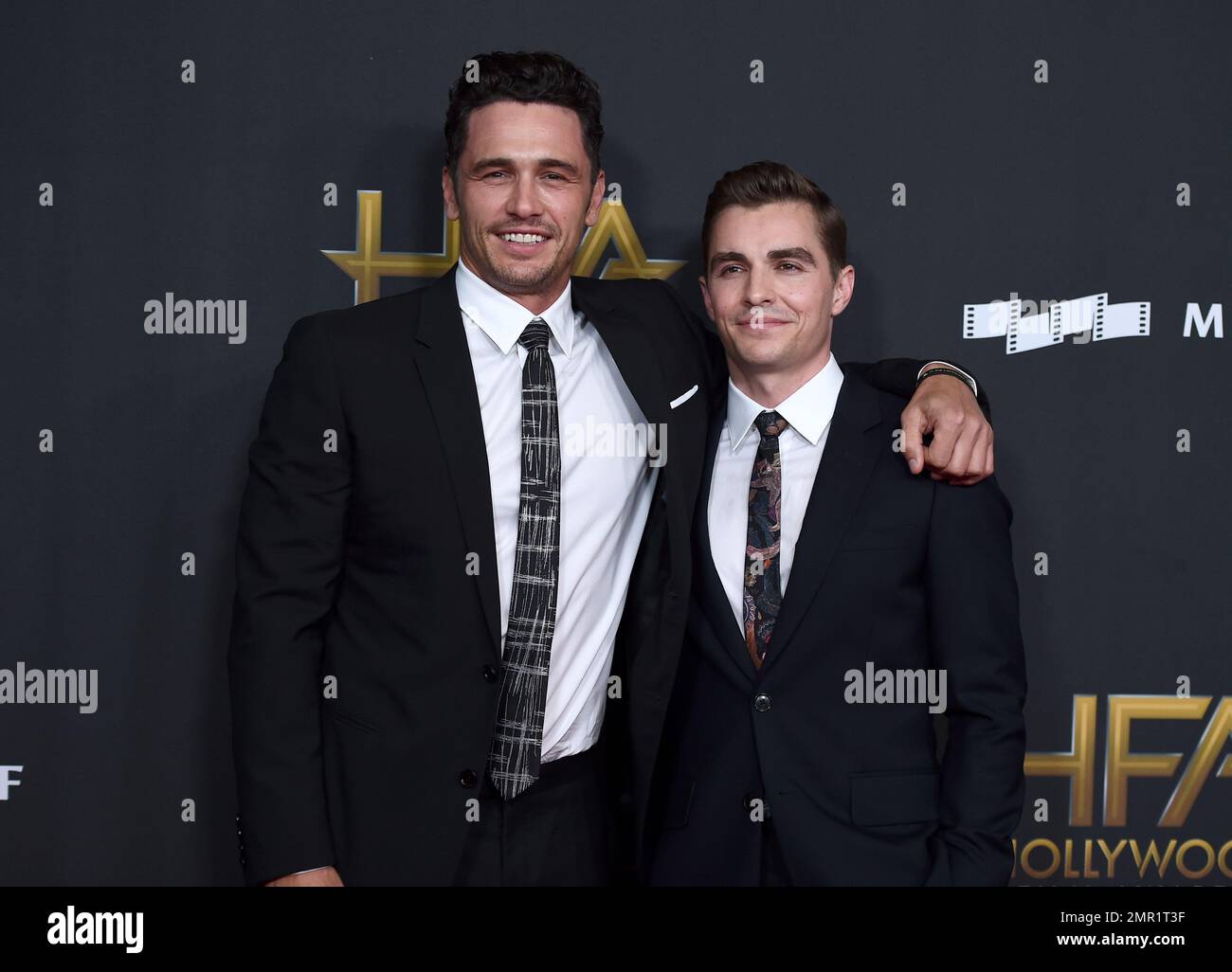 James Franco, left, and Dave Franco arrive at the Hollywood Film Awards ...