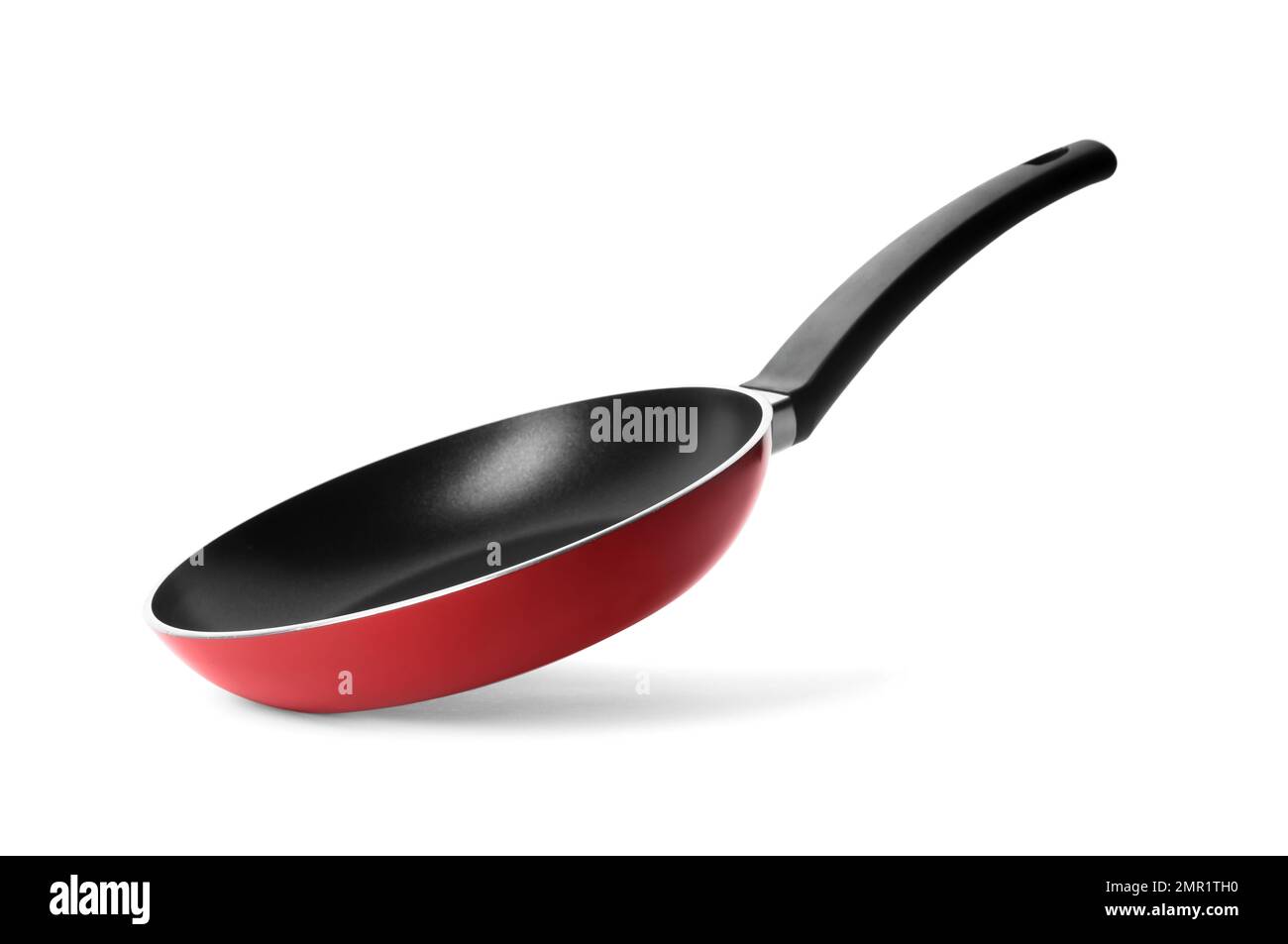 Modern red frying pan isolated on white Stock Photo - Alamy